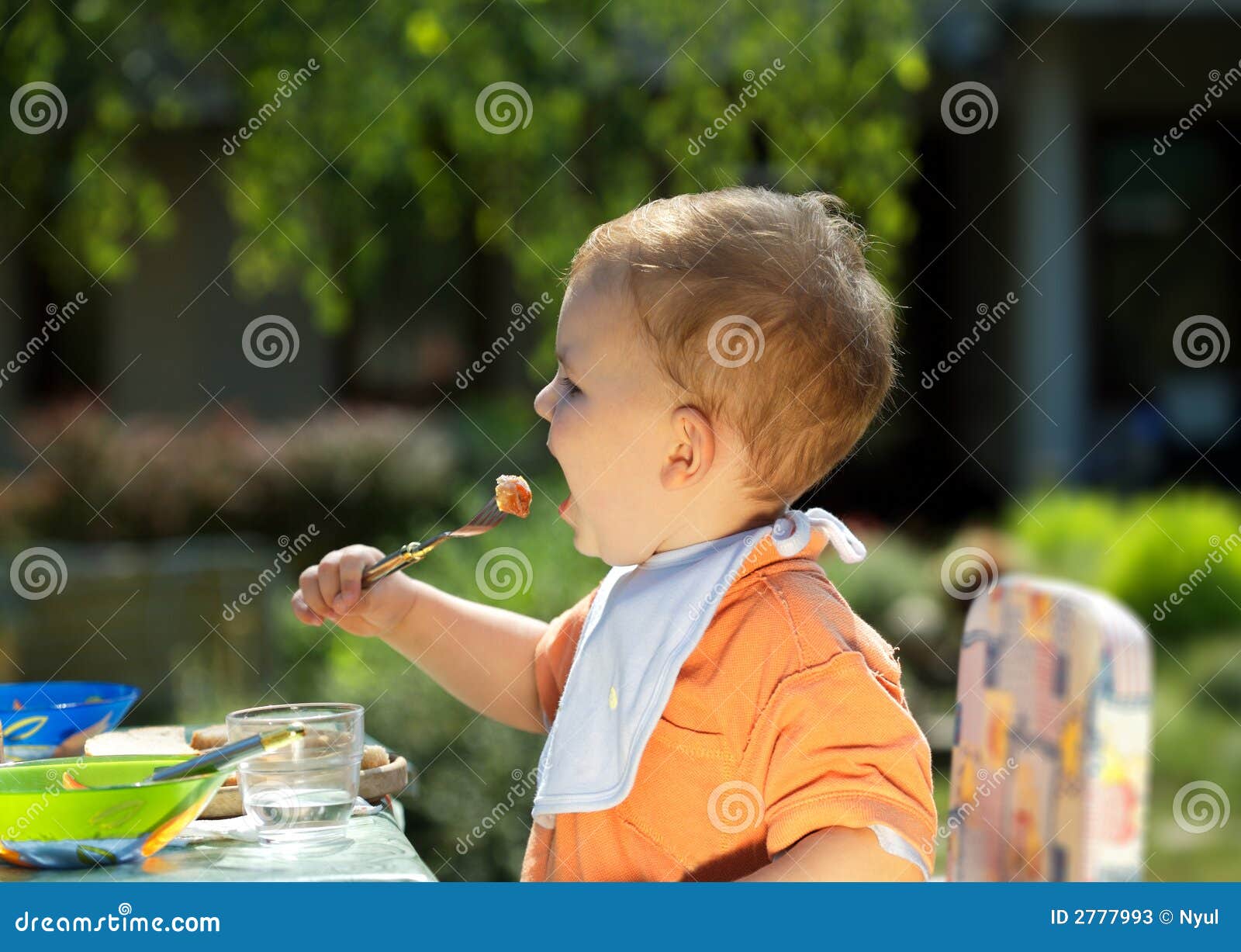 Baby boy eating stock image. Image of kids, gift, garden - 2777993