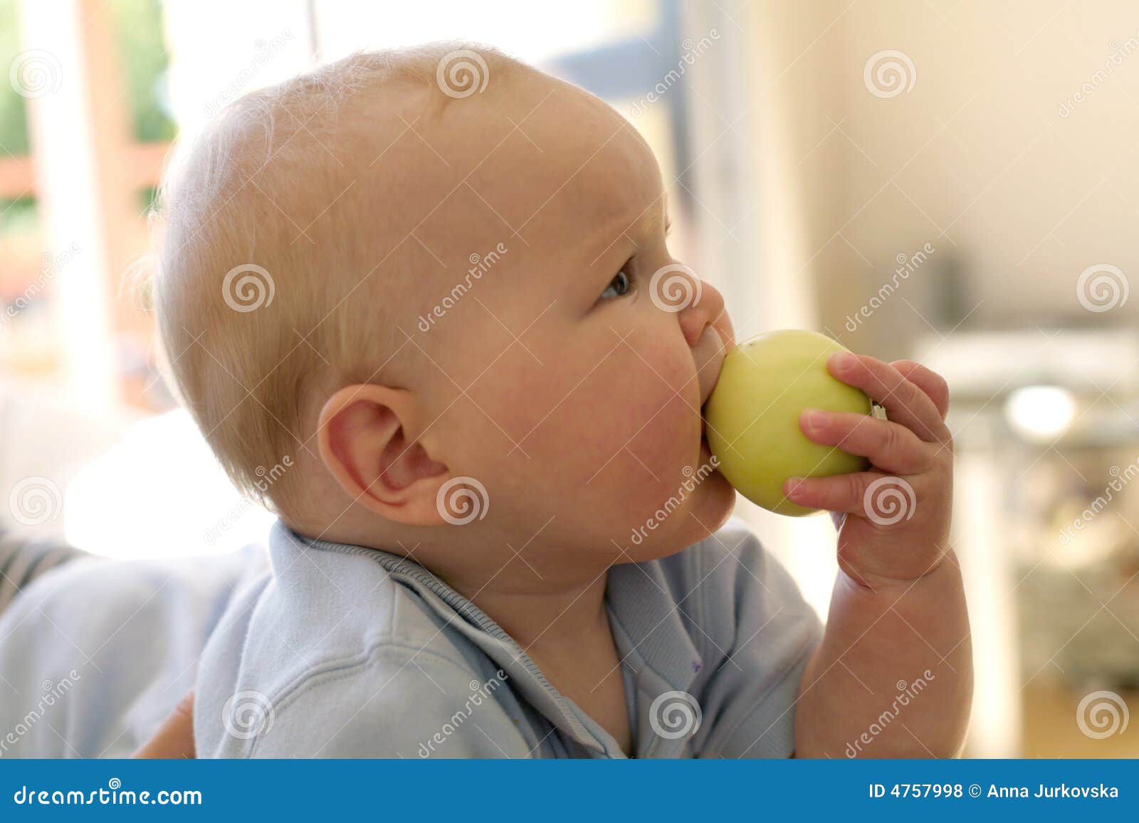 Baby boy eating apple stock photo. Image of food, light - 4757998