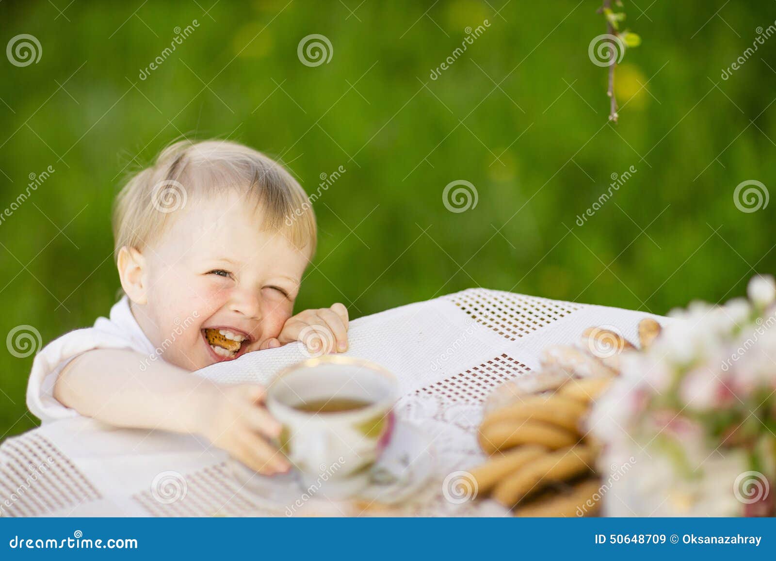 Baby boy eating bakery stock image. Image of child, outdoor - 50648709