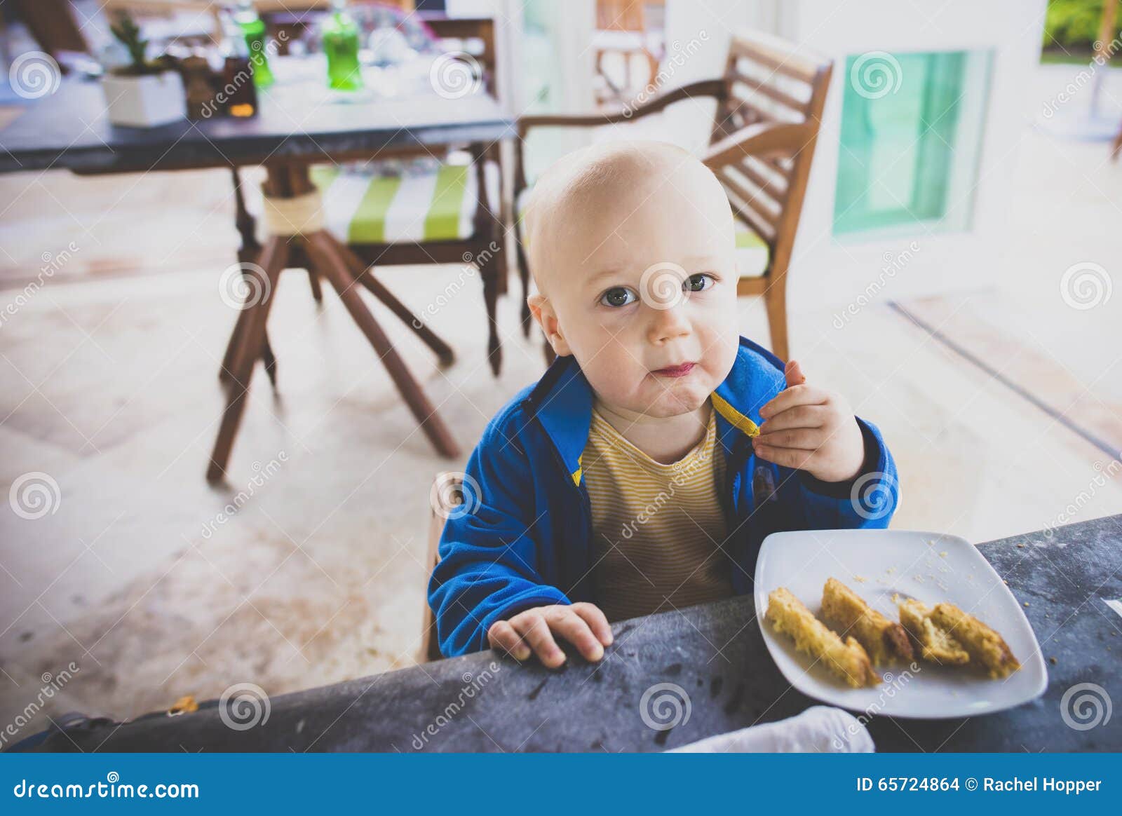 Baby Boy Eats Breakfast at a Resort in Mexico Stock Photo - Image of ...