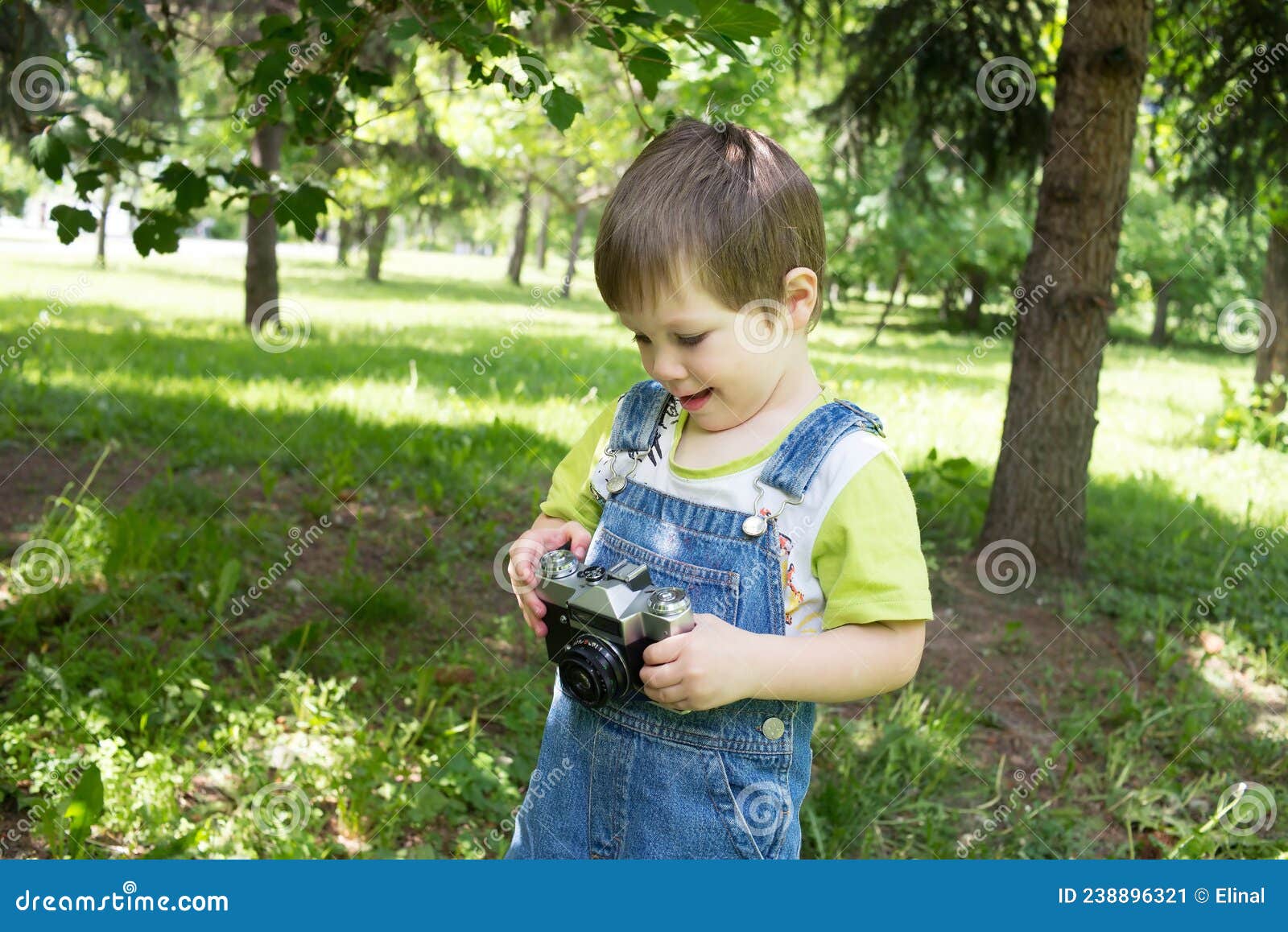 Baby Boy Exploring Camera. Little Photographer. Childhood Stock Image ... Baby Boy Exploring Camera. Little Photographer. Childhood Stock Image ...