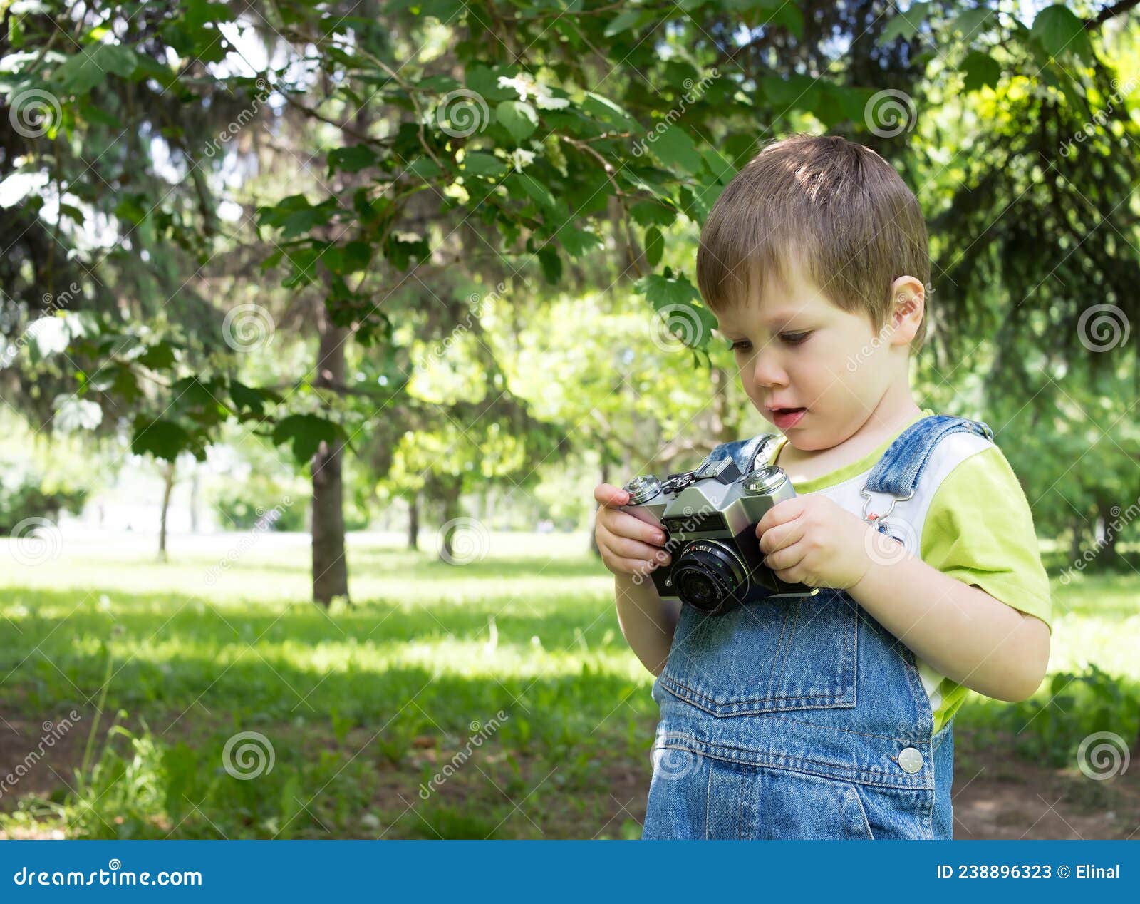 Baby Boy Exploring Camera. Little Photographer. Childhood Stock Image ... Baby Boy Exploring Camera. Little Photographer. Childhood Stock Image ...