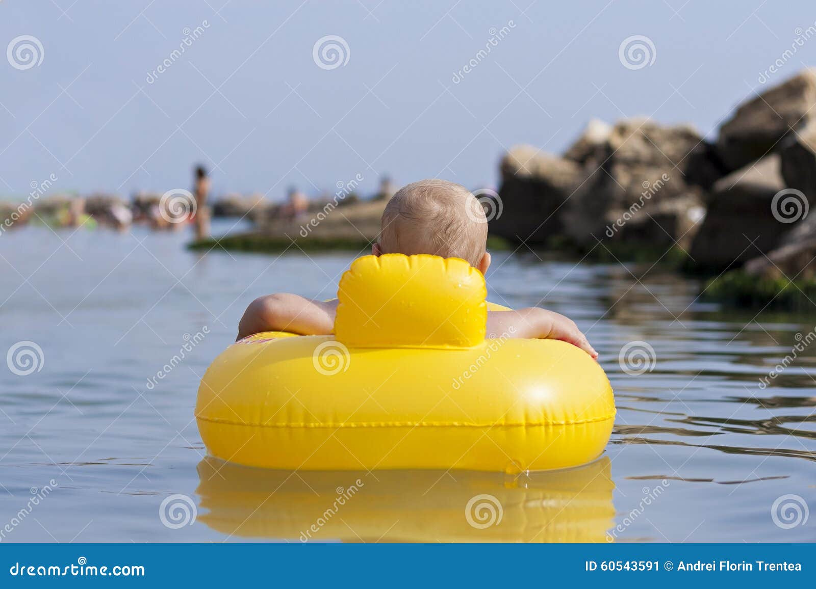 Baby boy floating on sea stock image. Image of tube, play - 60543591