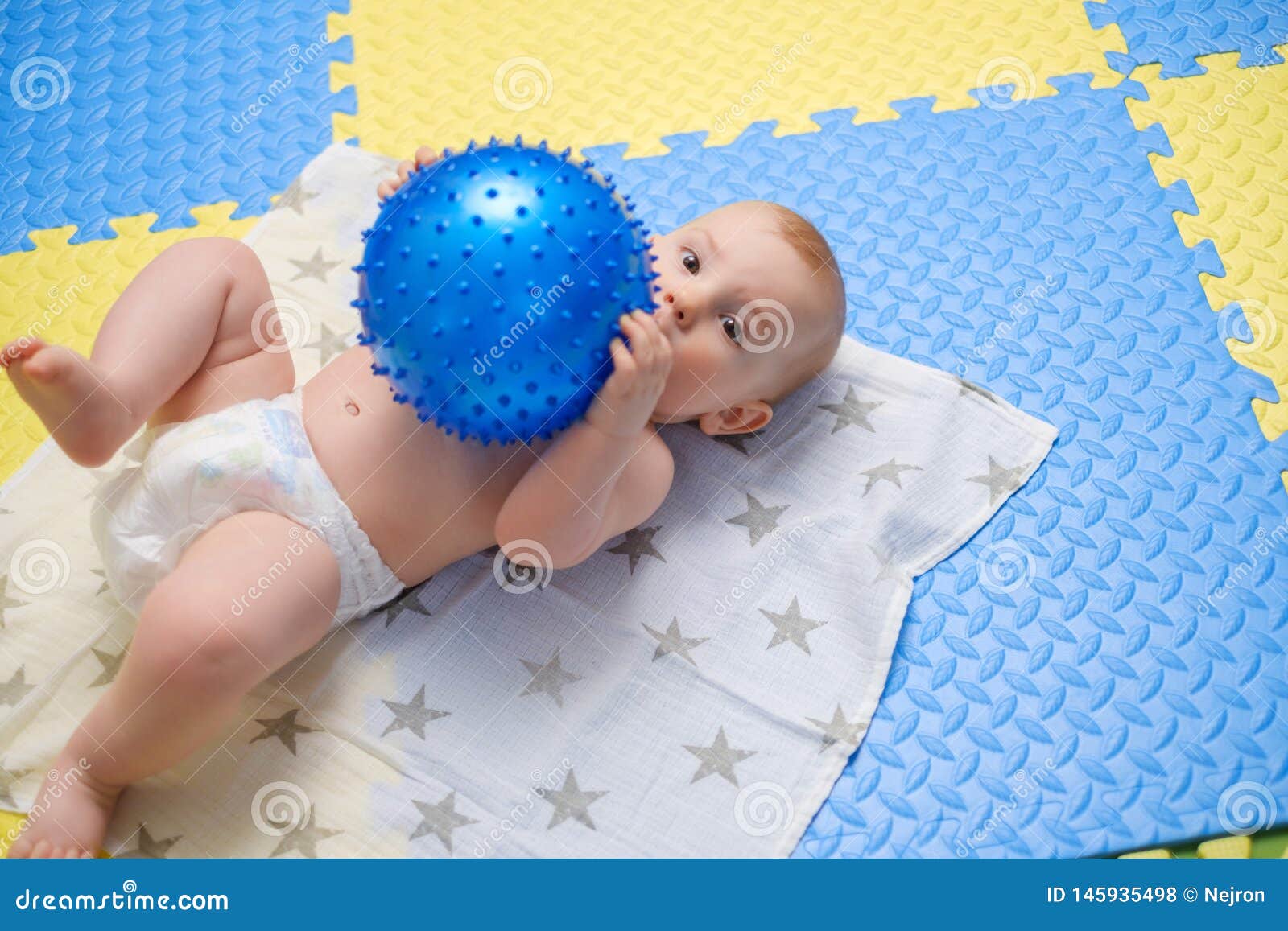 Baby Boy Getting Massage with Special Equipment Stock Photo - Image of ...