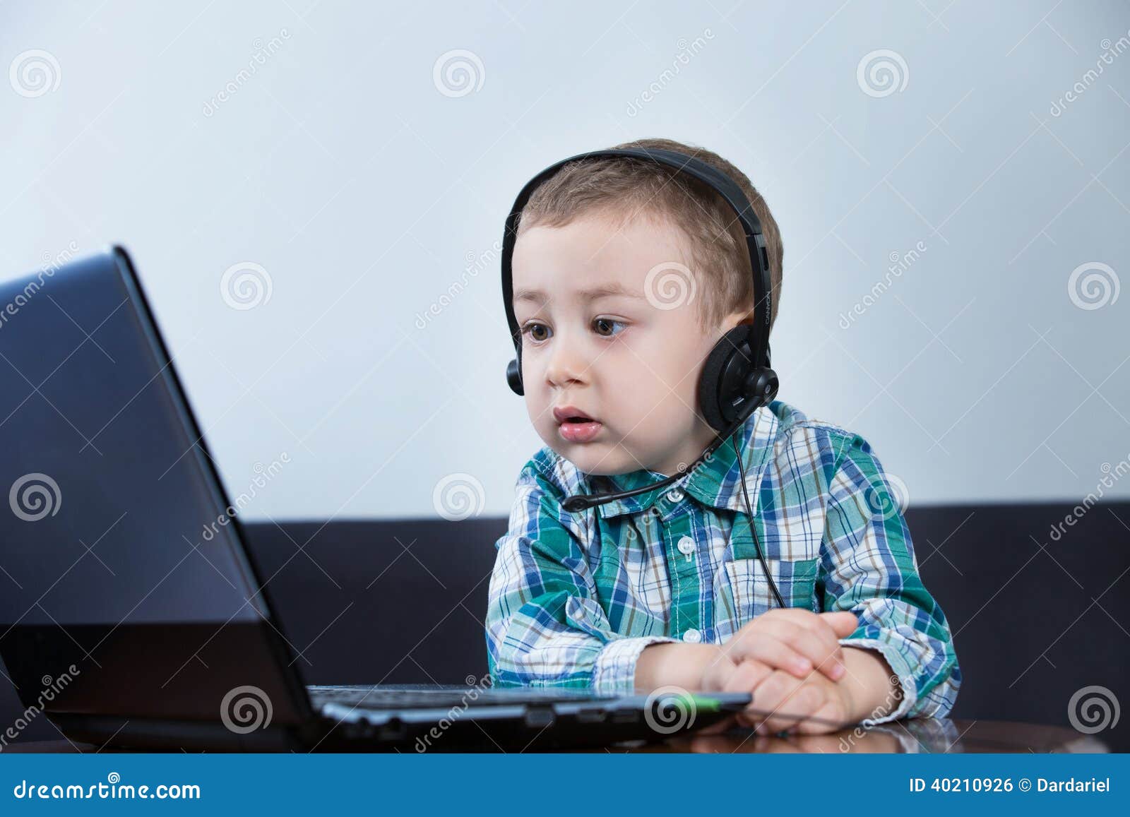 Baby Boy with Headphones Using the Computer Stock Photo - Image of ...