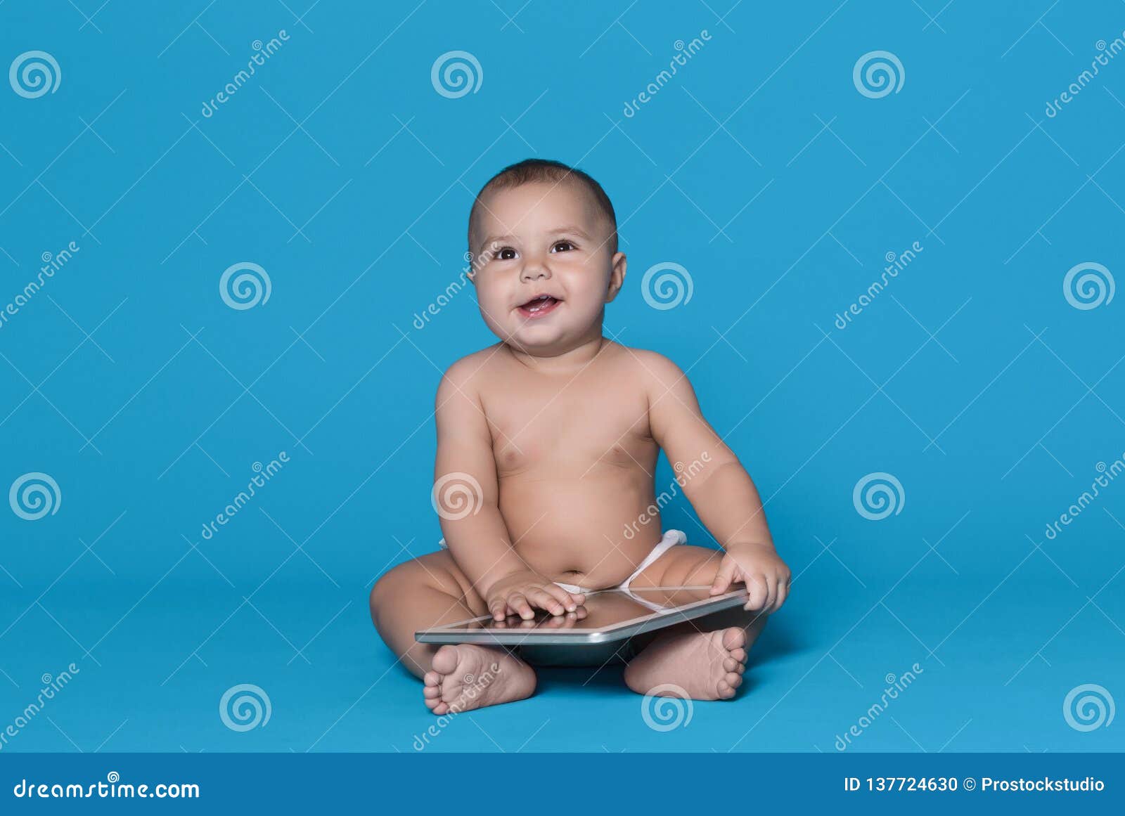 Baby Boy Holding Tablet Pc, Studio Background Stock Photo - Image of ...
