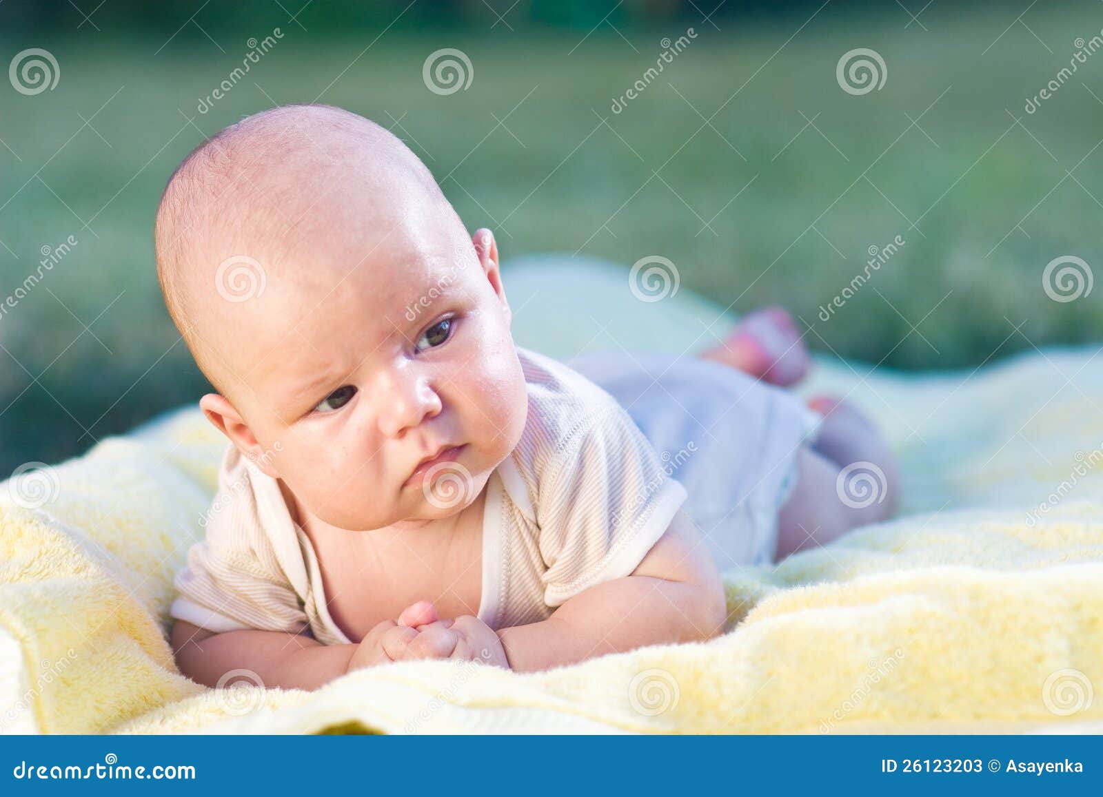 Baby boy laying down stock image. Image of head, looking - 26123203