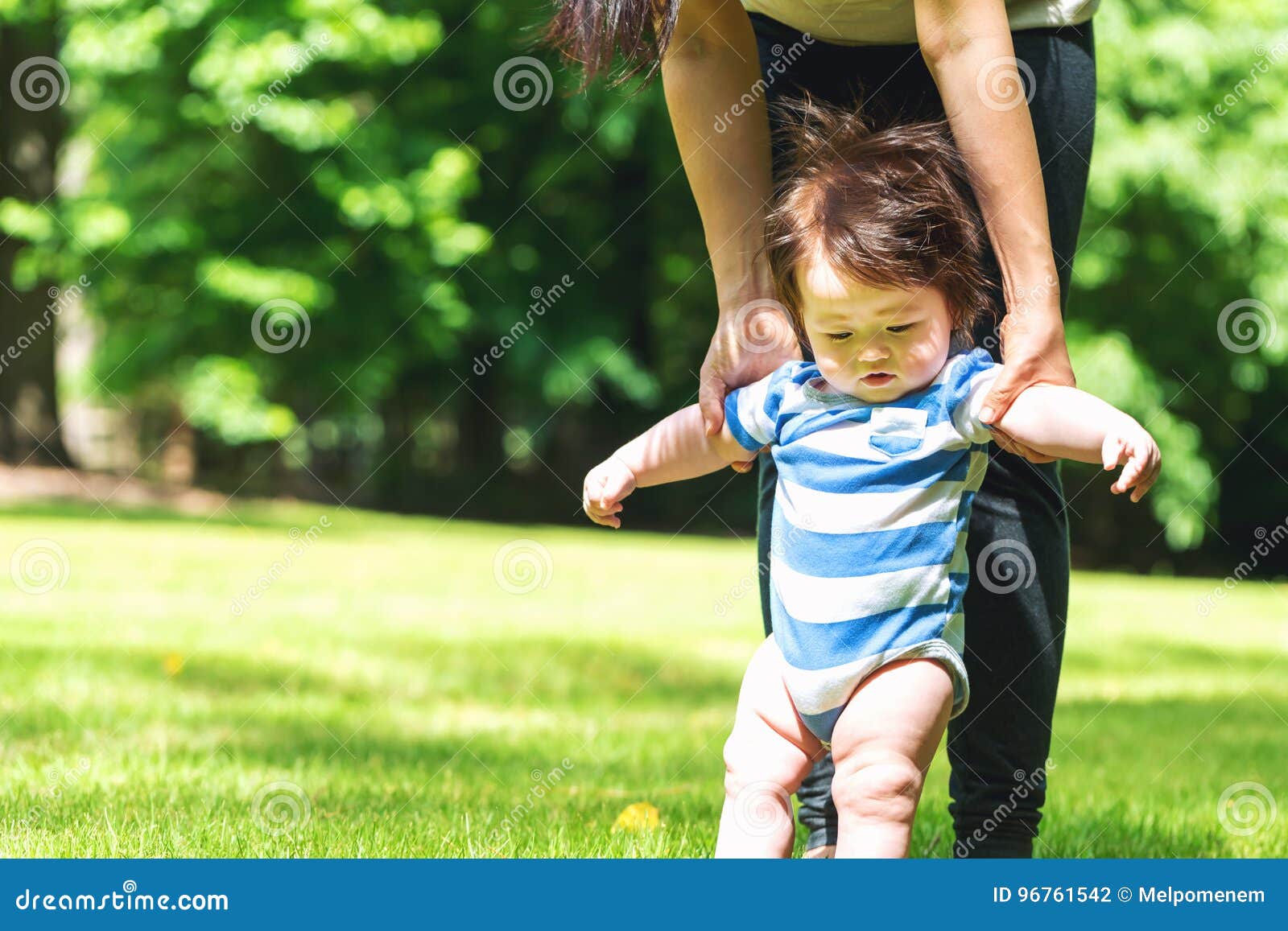 Baby Boy Learning To Walk Outside Stock Photo - Image of hold ...