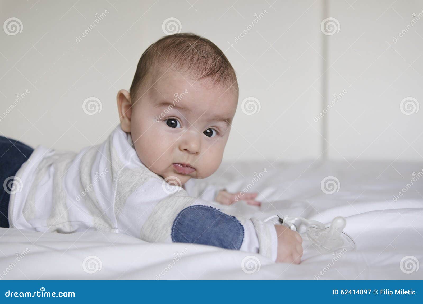 Baby boy lying on belly stock image. Image of head, positive - 62414897