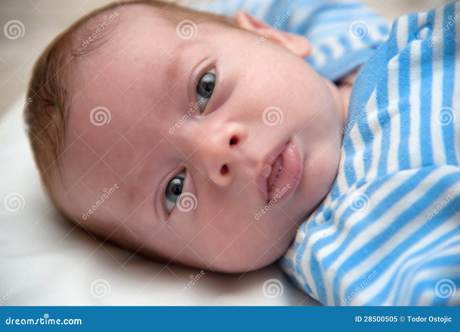 Baby boy lying down stock image. Image of childhood, baby - 28500505