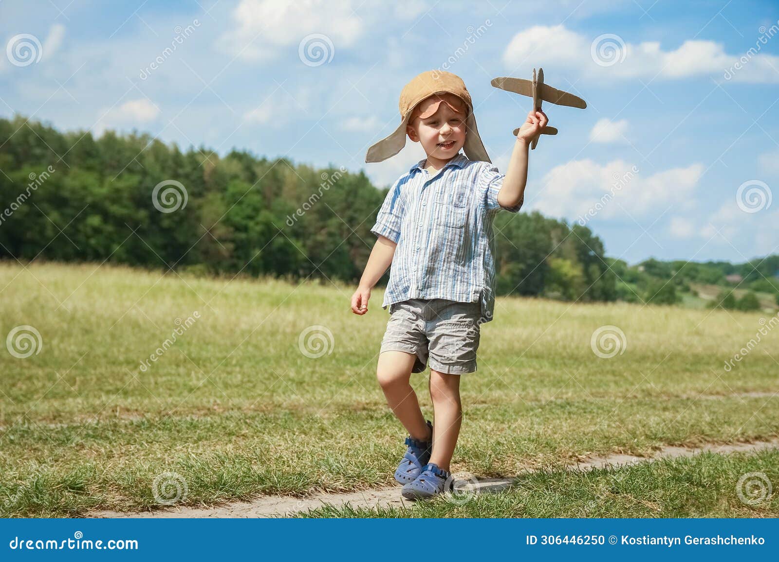 A Baby Boy by the Plane Plays on Nature in the Park. Boy on Vacation ...