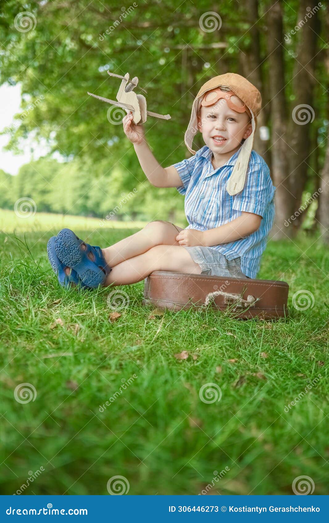 A Baby Boy by the Plane Plays on Nature in the Park. Boy on Vacation ...