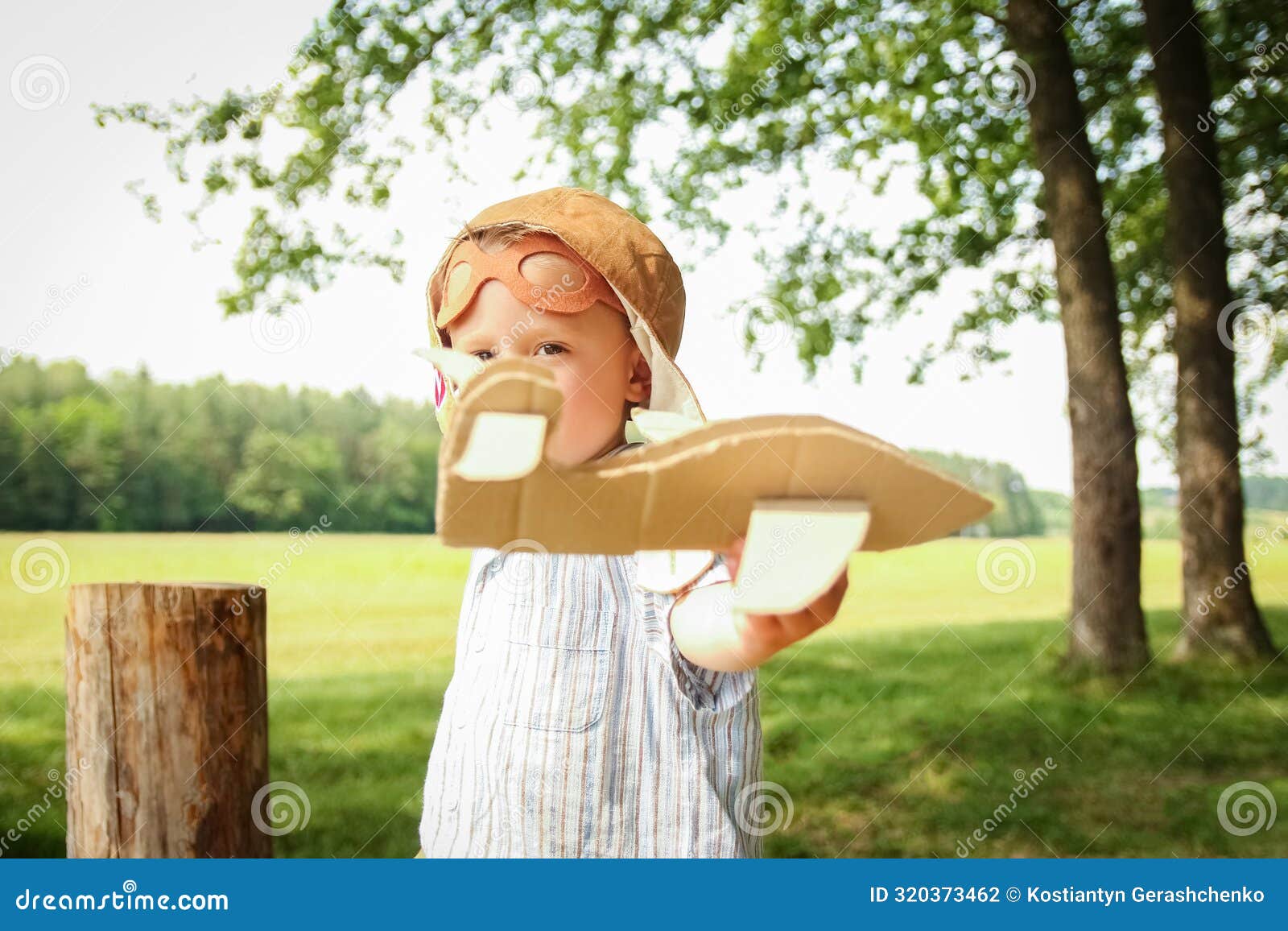 A Baby Boy by the Plane Plays on Nature in the Park. Boy on Vacation ...