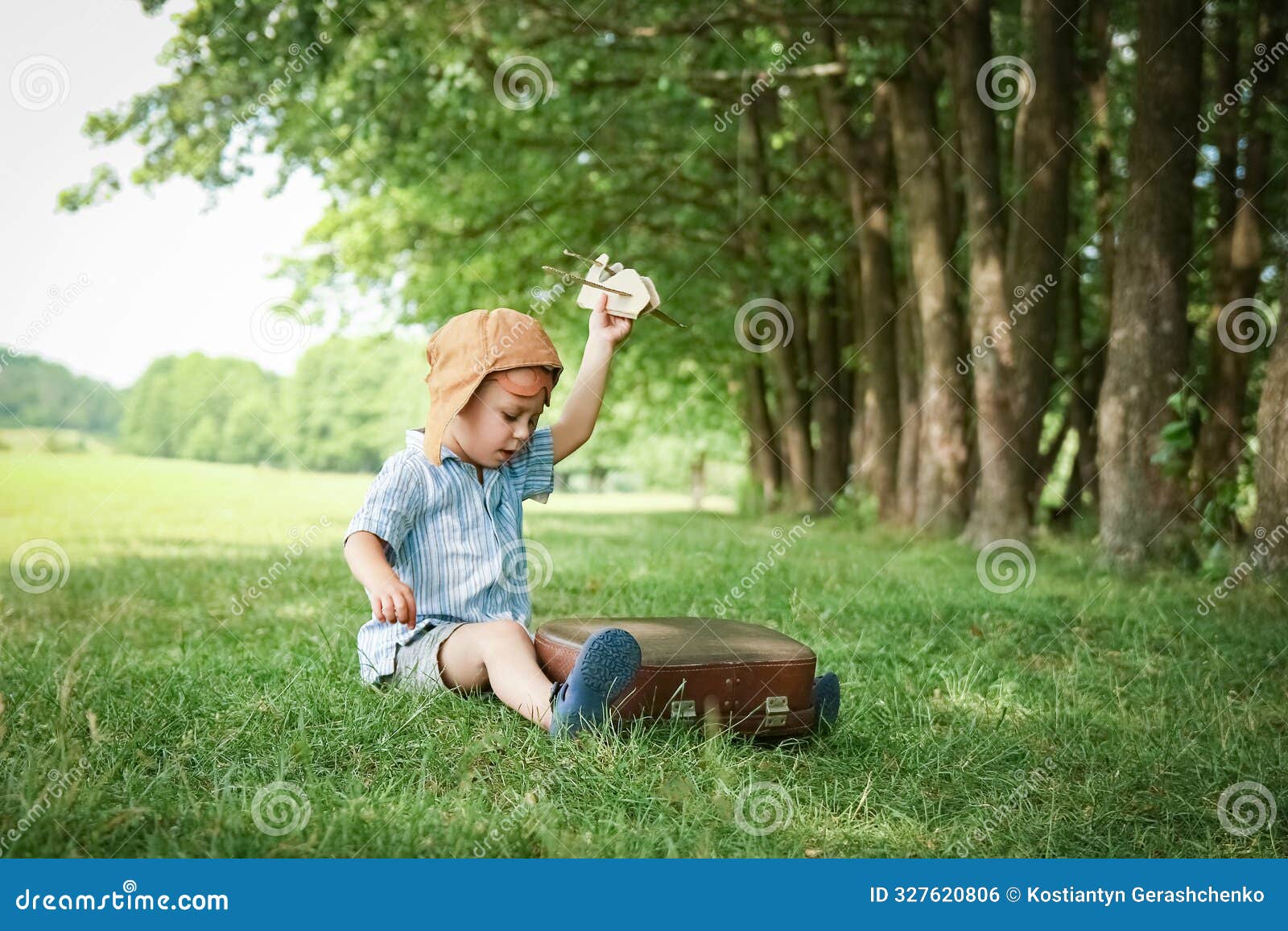 A Baby Boy by the Plane Plays on Nature in the Park. Boy on Vacation ...