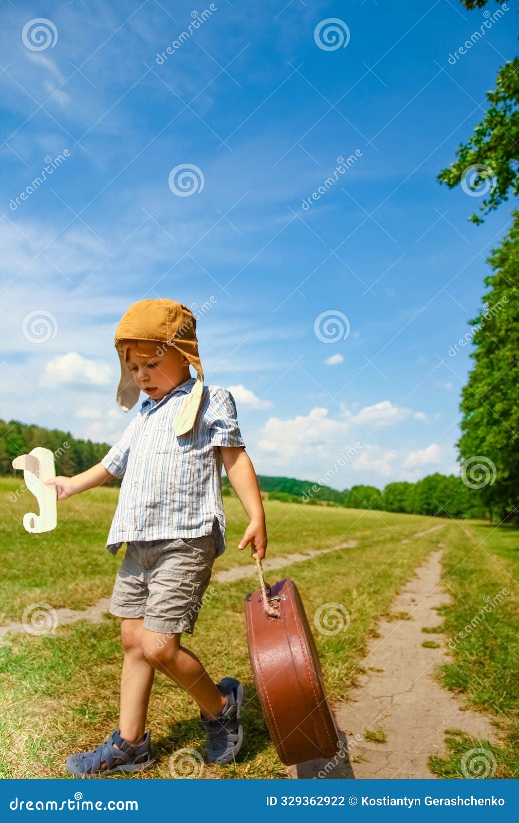 A Baby Boy by the Plane Plays on Nature in the Park. Boy on Vacation ...