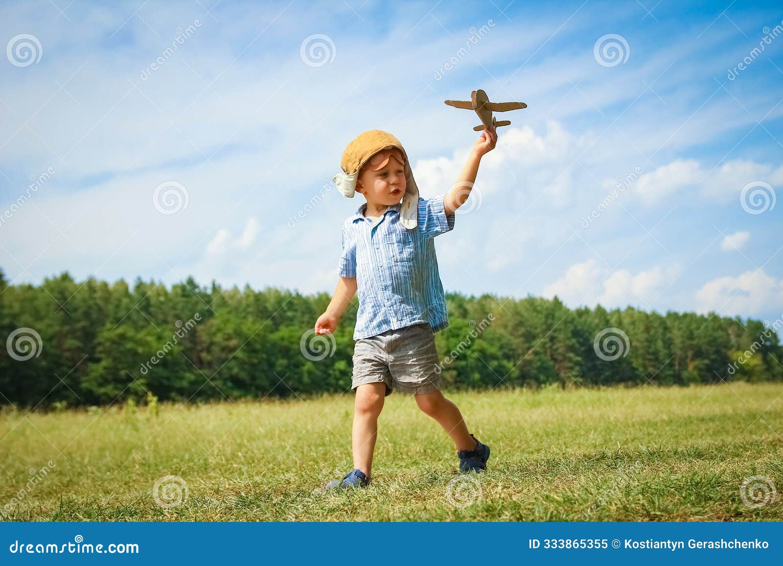 A Baby Boy by the Plane Plays on Nature in the Park. Boy on Vacation ...