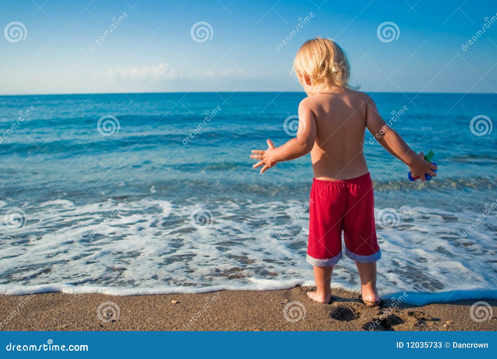 Baby boy play with wave stock image. Image of turkey - 12035733