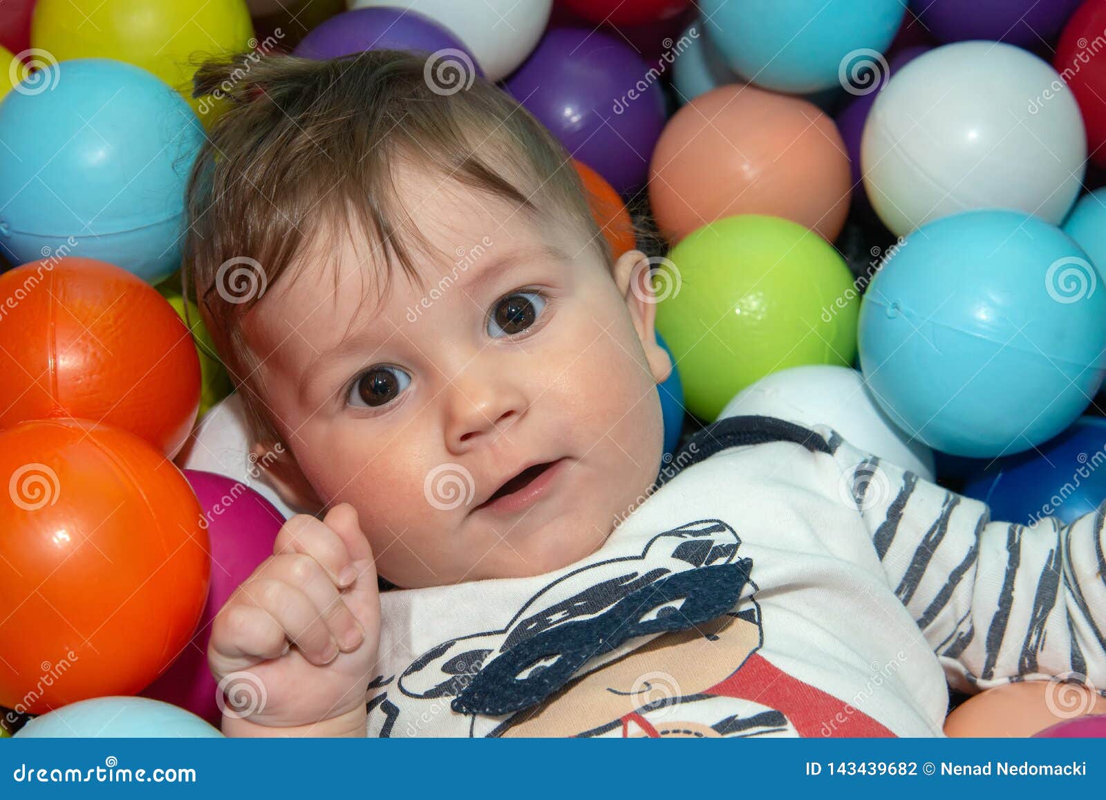 The Baby Boy is Playing with Color Balls Stock Photo - Image of ...
