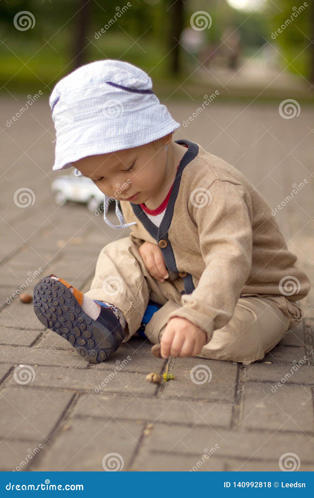 Baby Boy Playing on the Ground in the Par Stock Photo - Image of ...