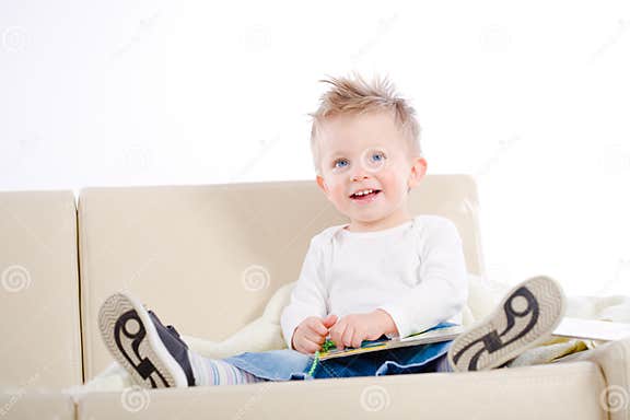 Baby boy reading book stock image. Image of carefree, innocent - 7155187