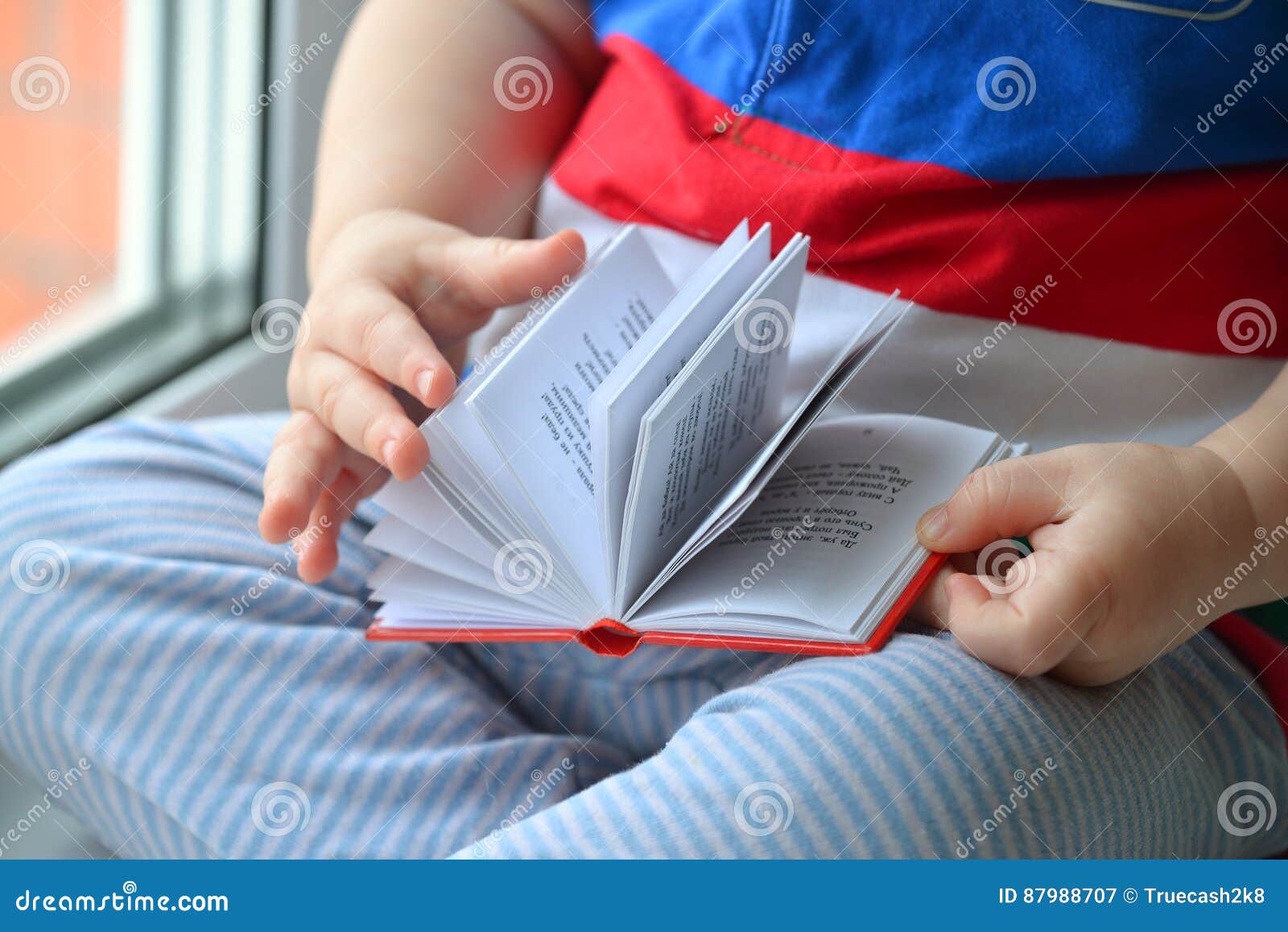 Baby Boy Reading a Book, Dclose Up of Hands Leafing through the Pages ...