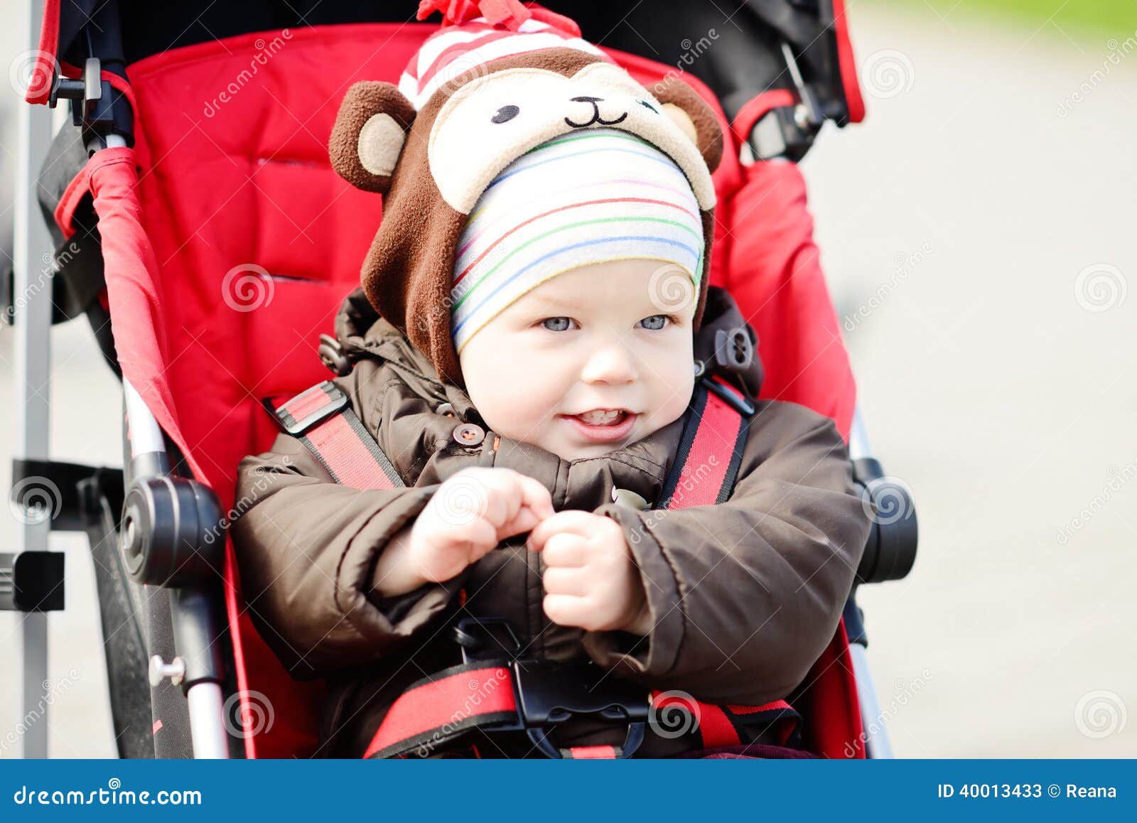 Baby boy in red stroller stock image. Image of cold, autumn - 40013433
