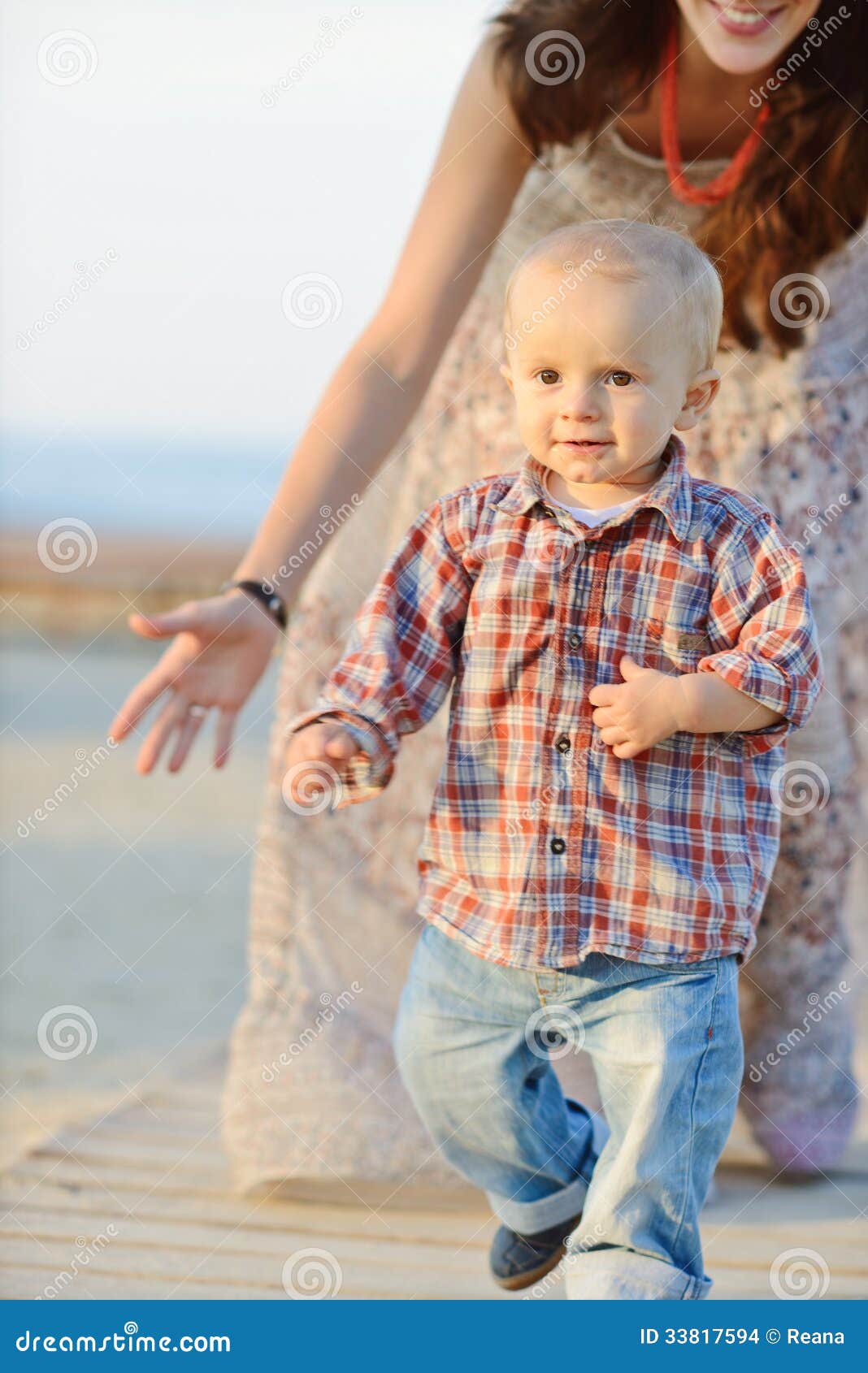 Baby Boy Running from Mother Stock Photo - Image of blue, hand: 33817594