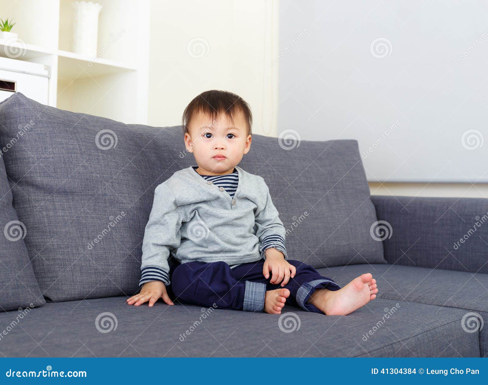Baby boy sit on sofa stock photo. Image of care, indoor - 41304384