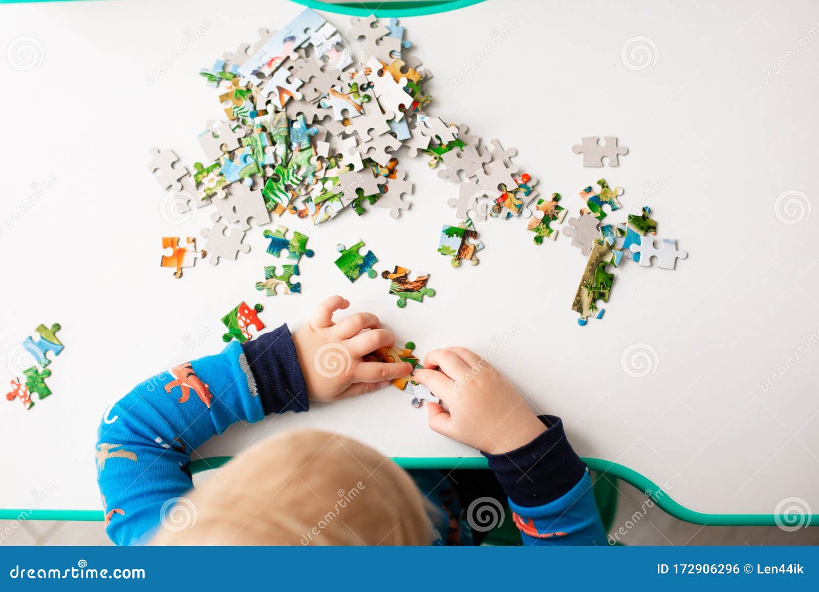 Baby Boy Solving Jigsaw Puzzle on the Desk Stock Photo - Image of mind ...