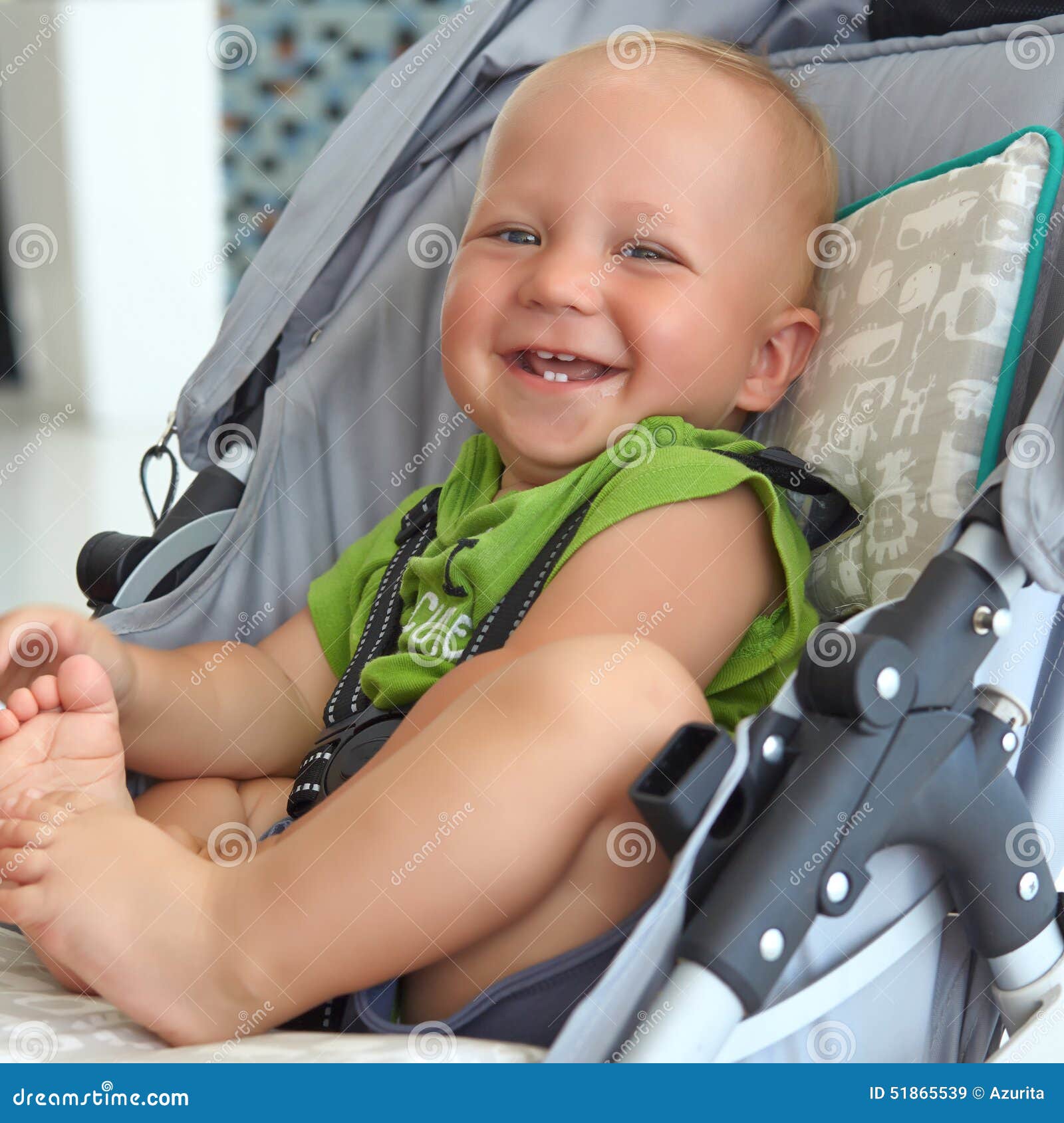 Baby boy in a stroller stock image. Image of happiness - 51865539