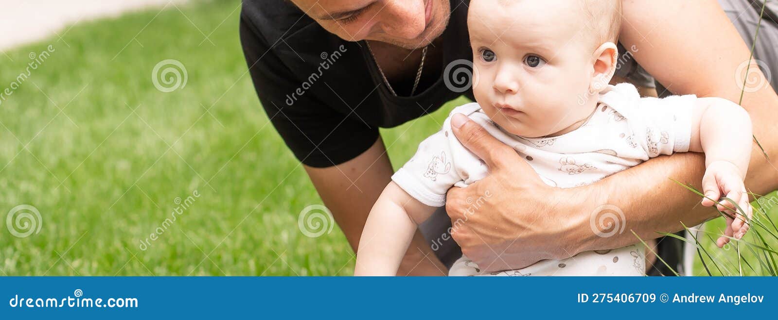 Baby Boy Taking First Steps with Father Help in a Park Stock Image ...