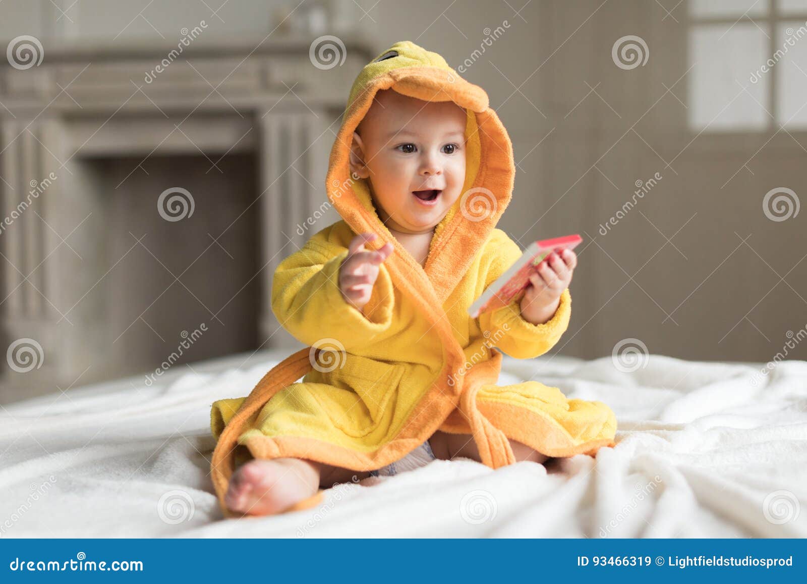 Baby boy in yellow robe stock image. Image of newborn - 93466319