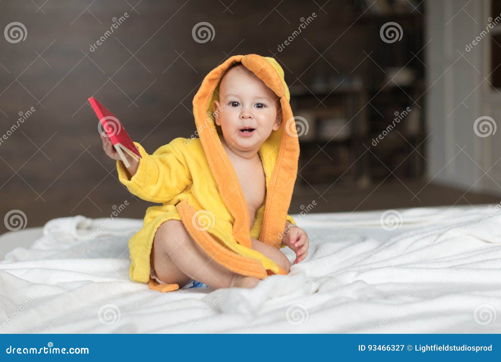 Baby boy in yellow robe stock image. Image of skin, robe - 93466327