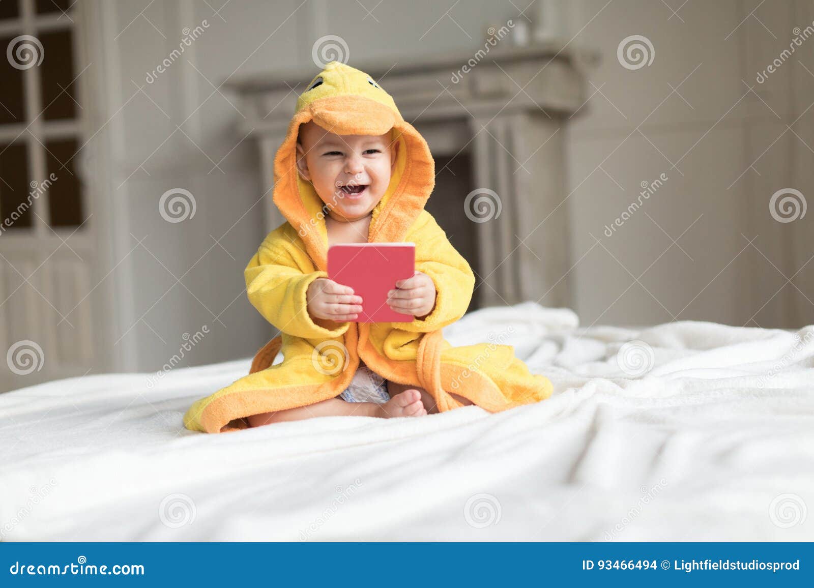 Baby boy in yellow robe stock photo. Image of toddler - 93466494
