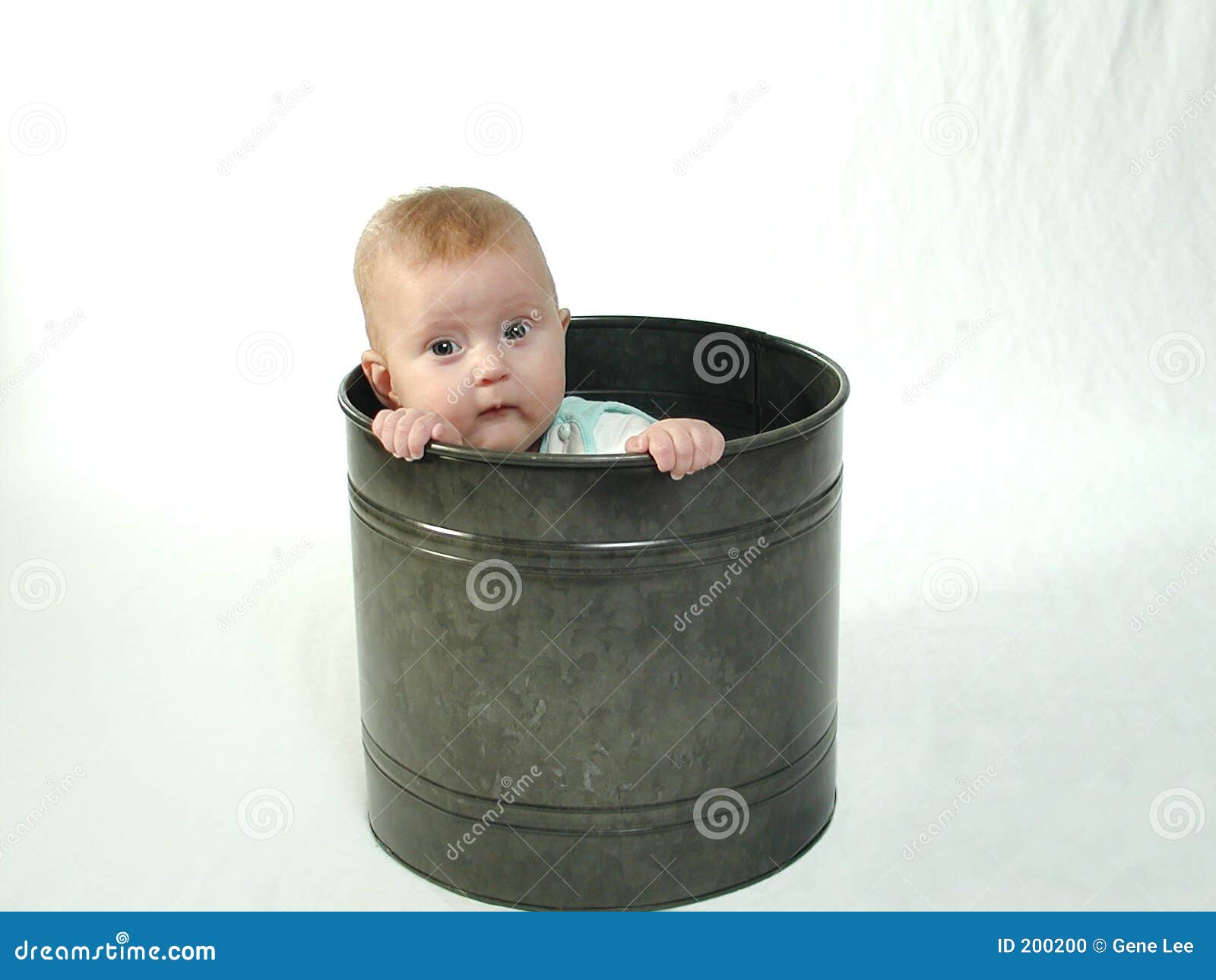 Baby in a Can stock photo. Image of juvenile, babies, serious - 200200