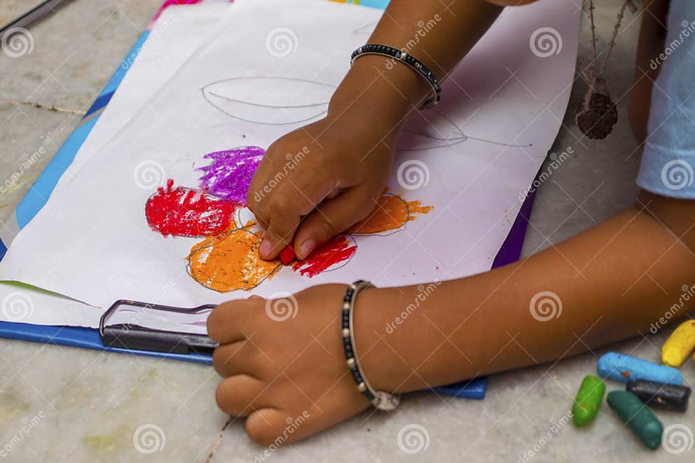 A Baby Child Writing on a Graphite Slate. Stock Photo - Image of ...