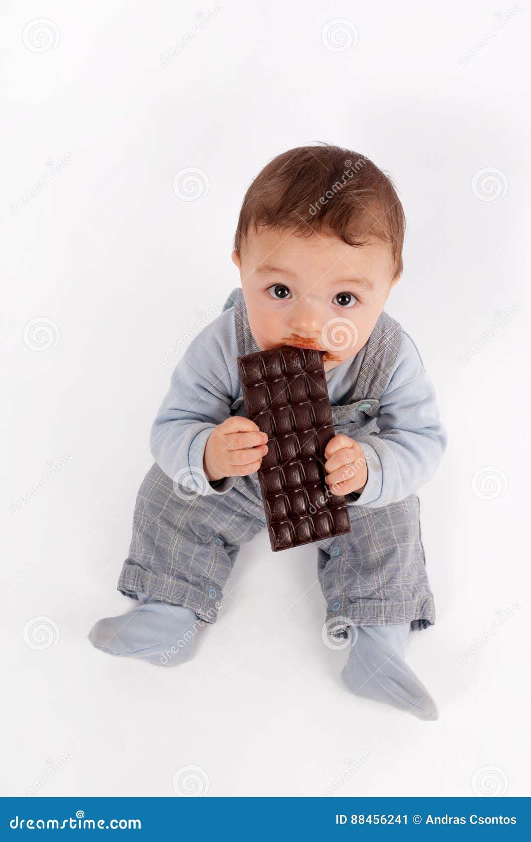 Baby and a chocolate stock image. Image of isolated, baby - 88456241