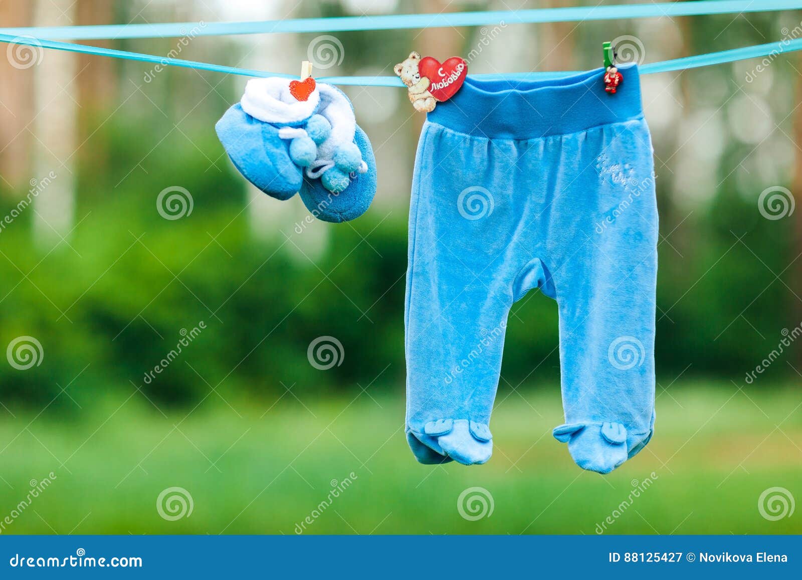 Baby Clothes Hanging on a Rope Outdoors Stock Image - Image of children ...