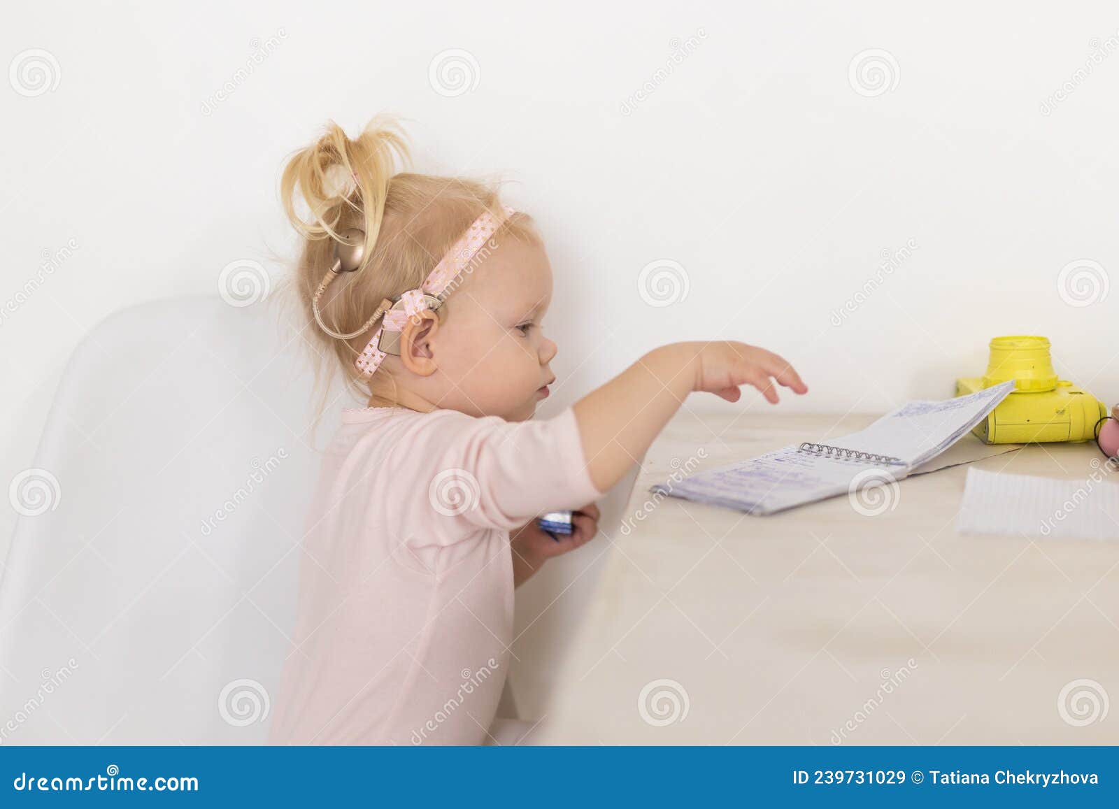 Child with Cochlear Implants Having Fun at Home. Deafness and Medical ...