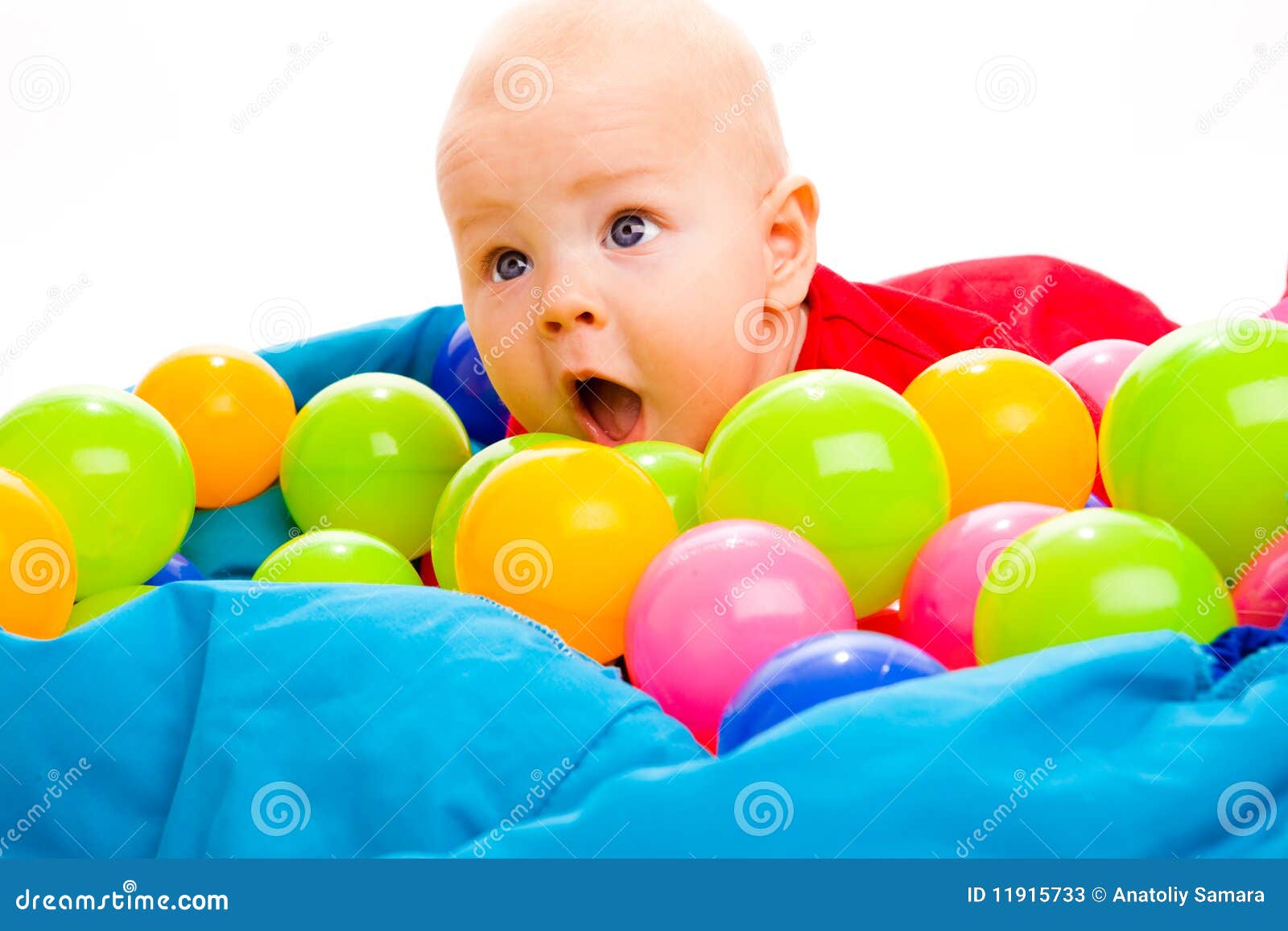 Baby with colorful balls stock image. Image of ball, crawling - 11915733
