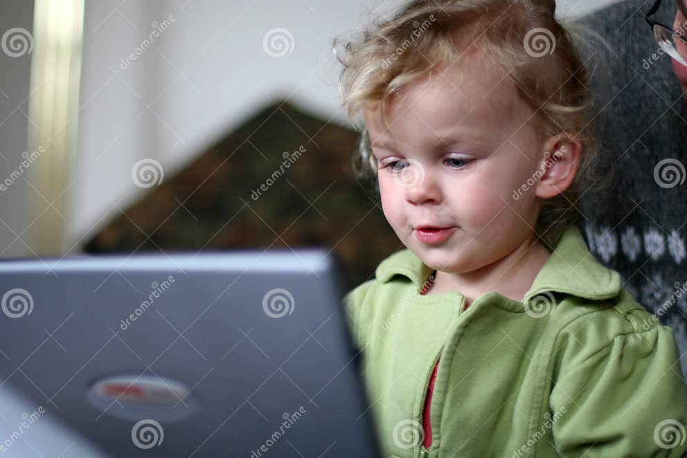 Baby at a Computer stock photo. Image of girl, interesting - 2266834