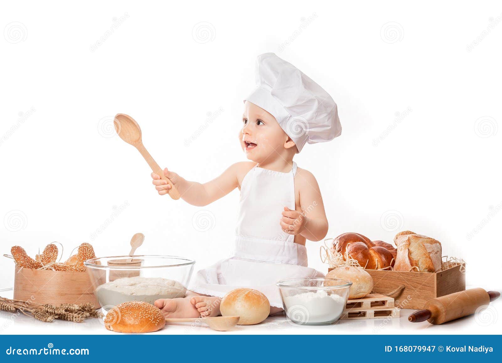 Baby Cook Sits on the Table Bread Bread Flour Stock Image - Image of ...