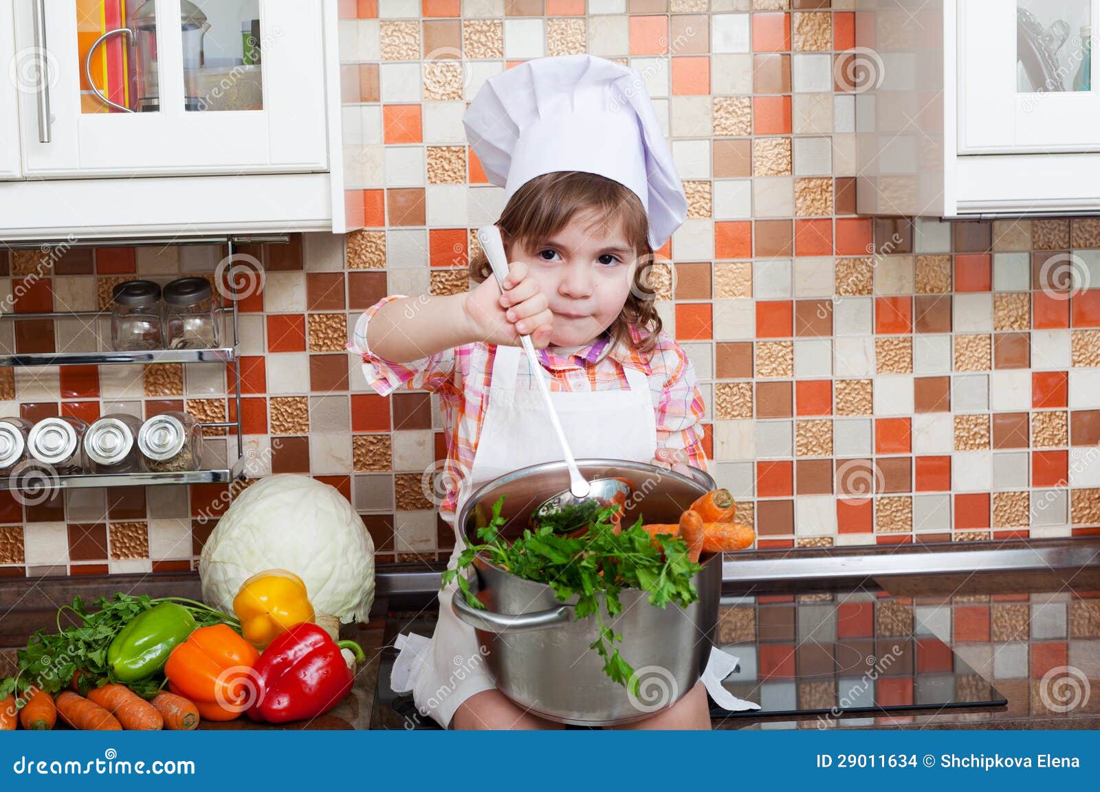 Baby cook with vegetables stock photo. Image of cutting - 29011634