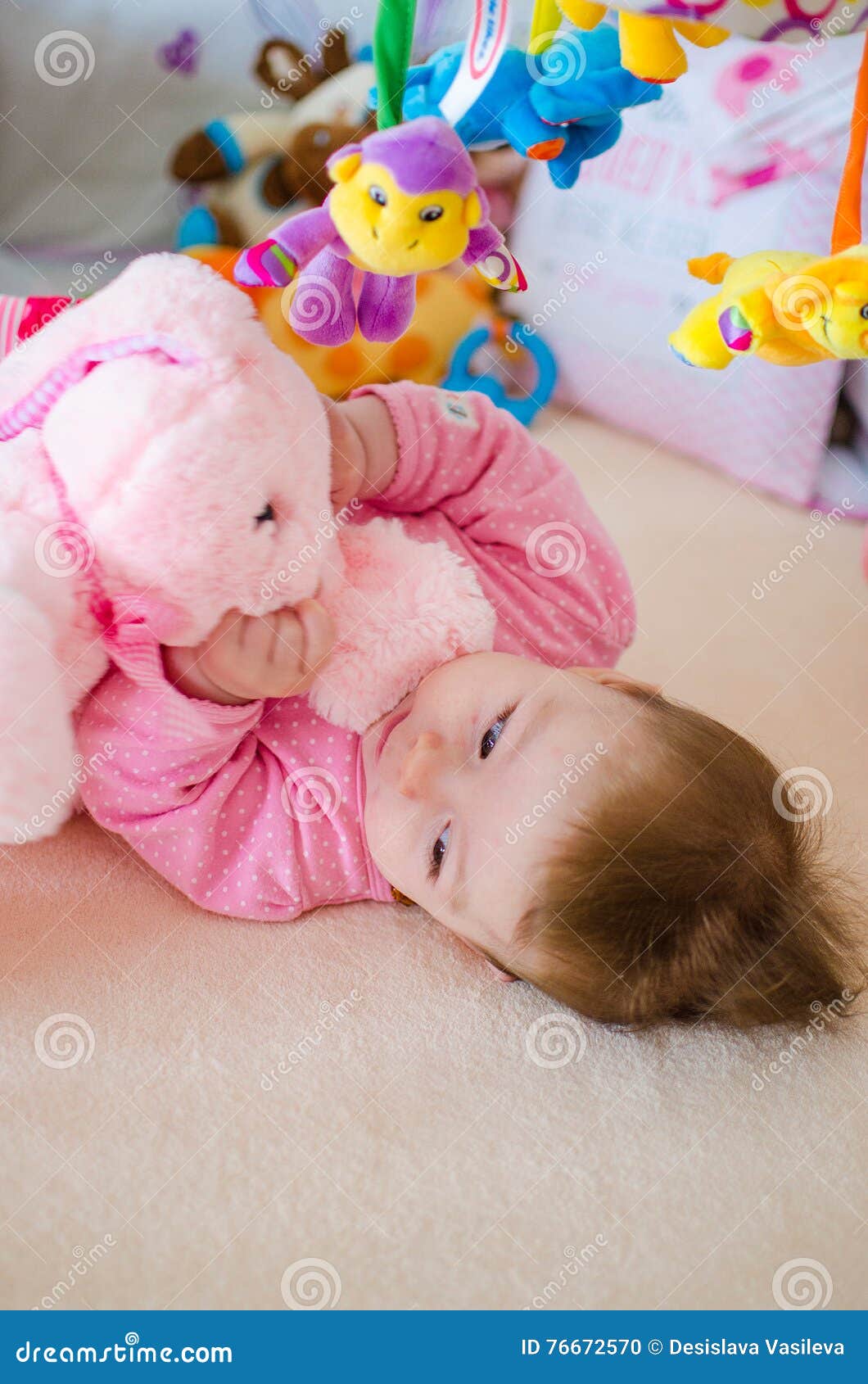 Baby in a cot stock photo. Image of soft, look, bedroom - 76672570