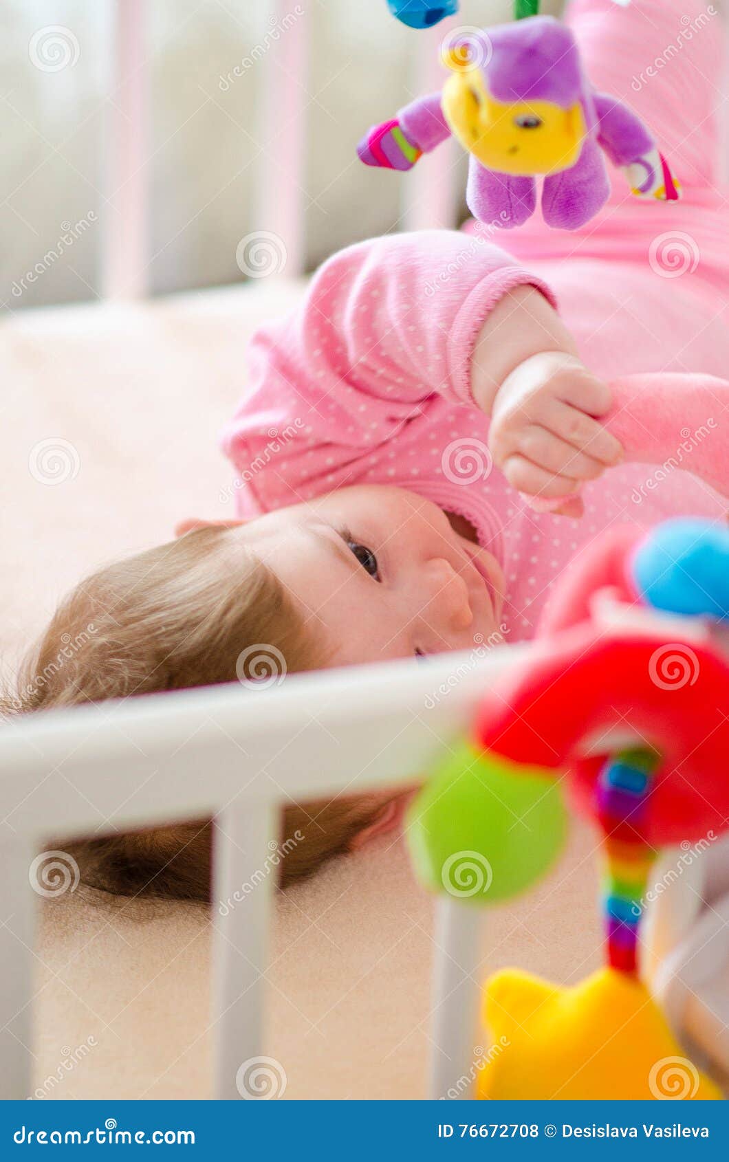 Baby in a cot stock photo. Image of girl, crib, home - 76672708