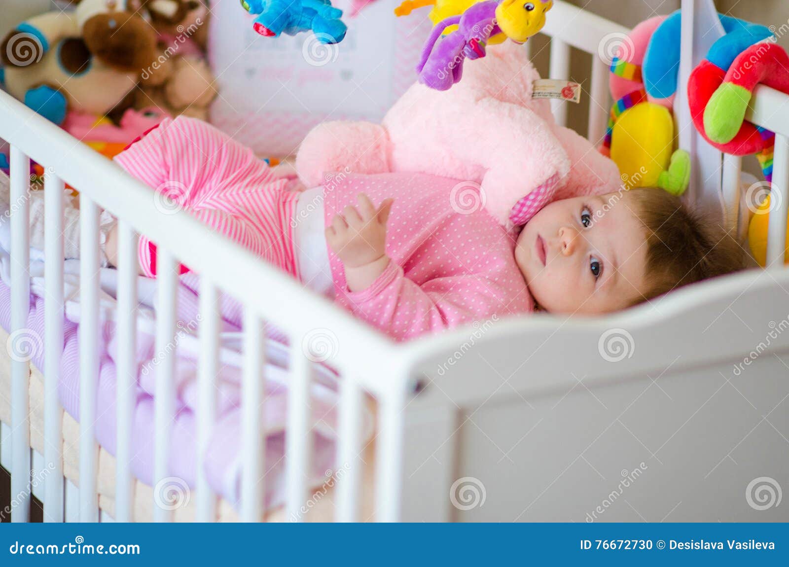 Baby in a cot stock photo. Image of months, child, happy - 76672730