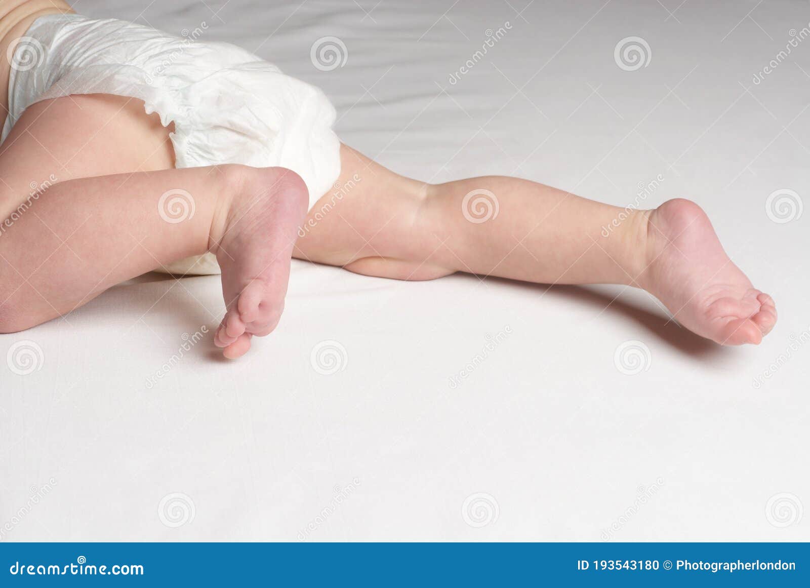 Baby Crawling on Bed Close Up of Feet Stock Photo - Image of child ...