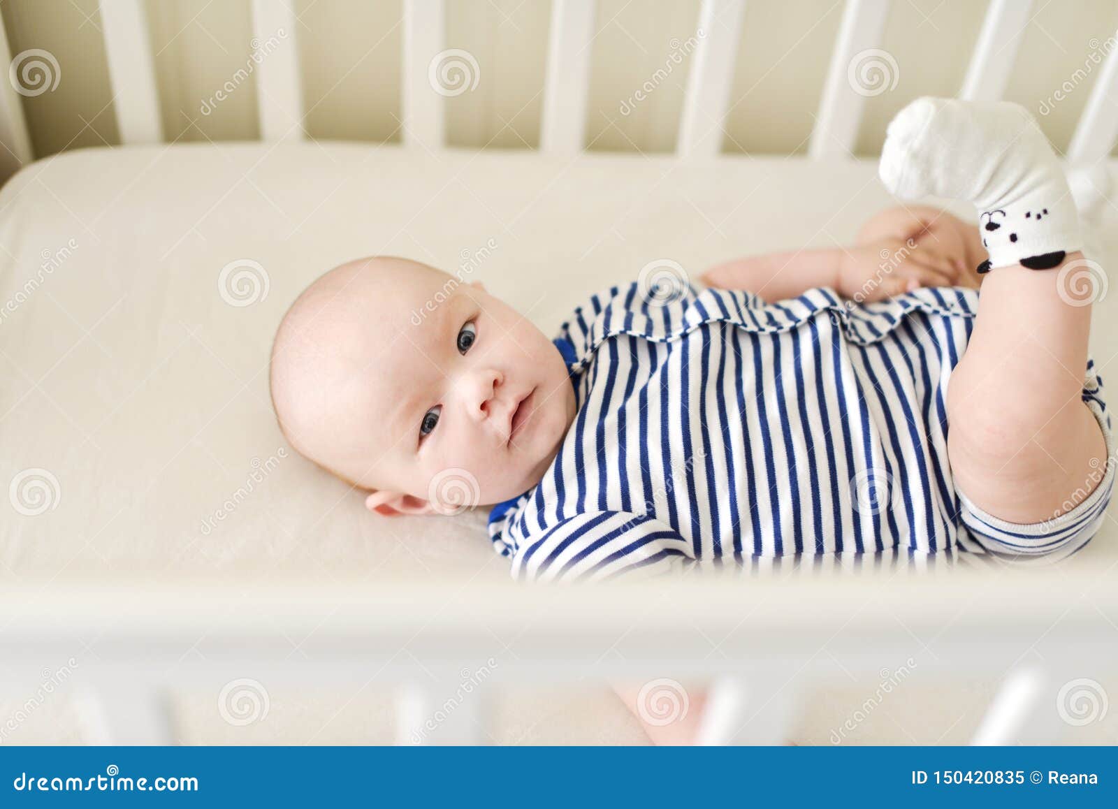 Baby in crib stock image. Image of amusement, baby, amazing - 150420835