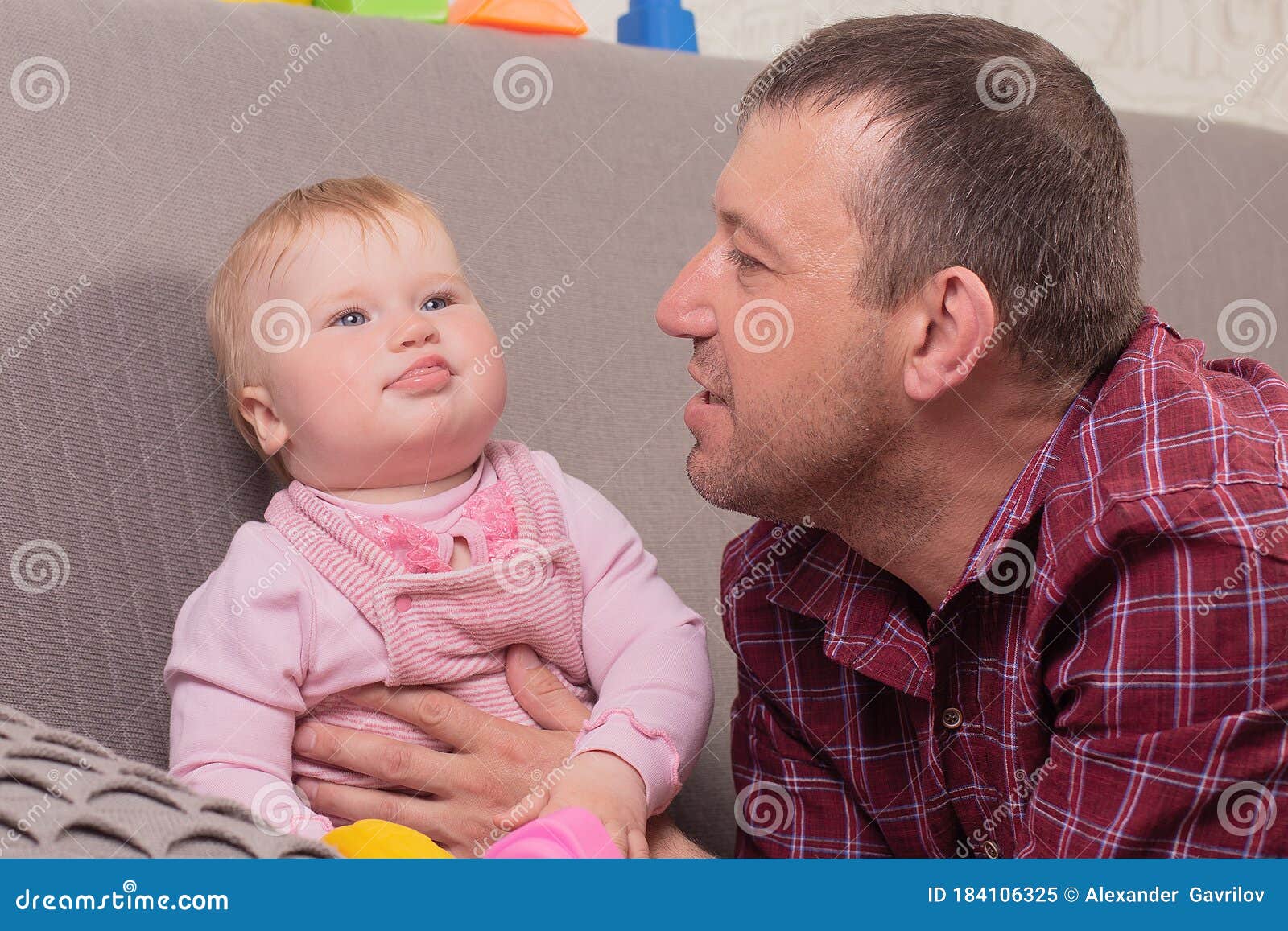 Baby And Daddy Dream Of Becoming A Pilot. Child Sits On Father`s Neck ...