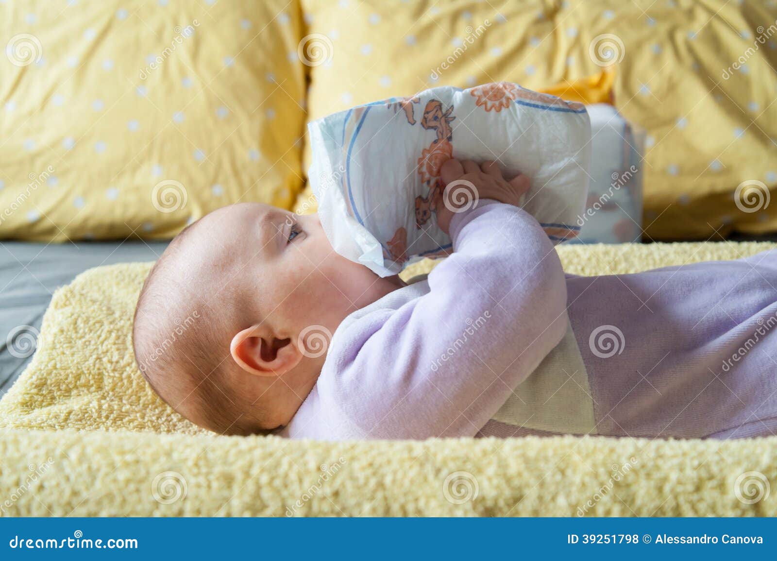 Baby bite a diaper stock photo. Image of girl, changingtable - 39251798